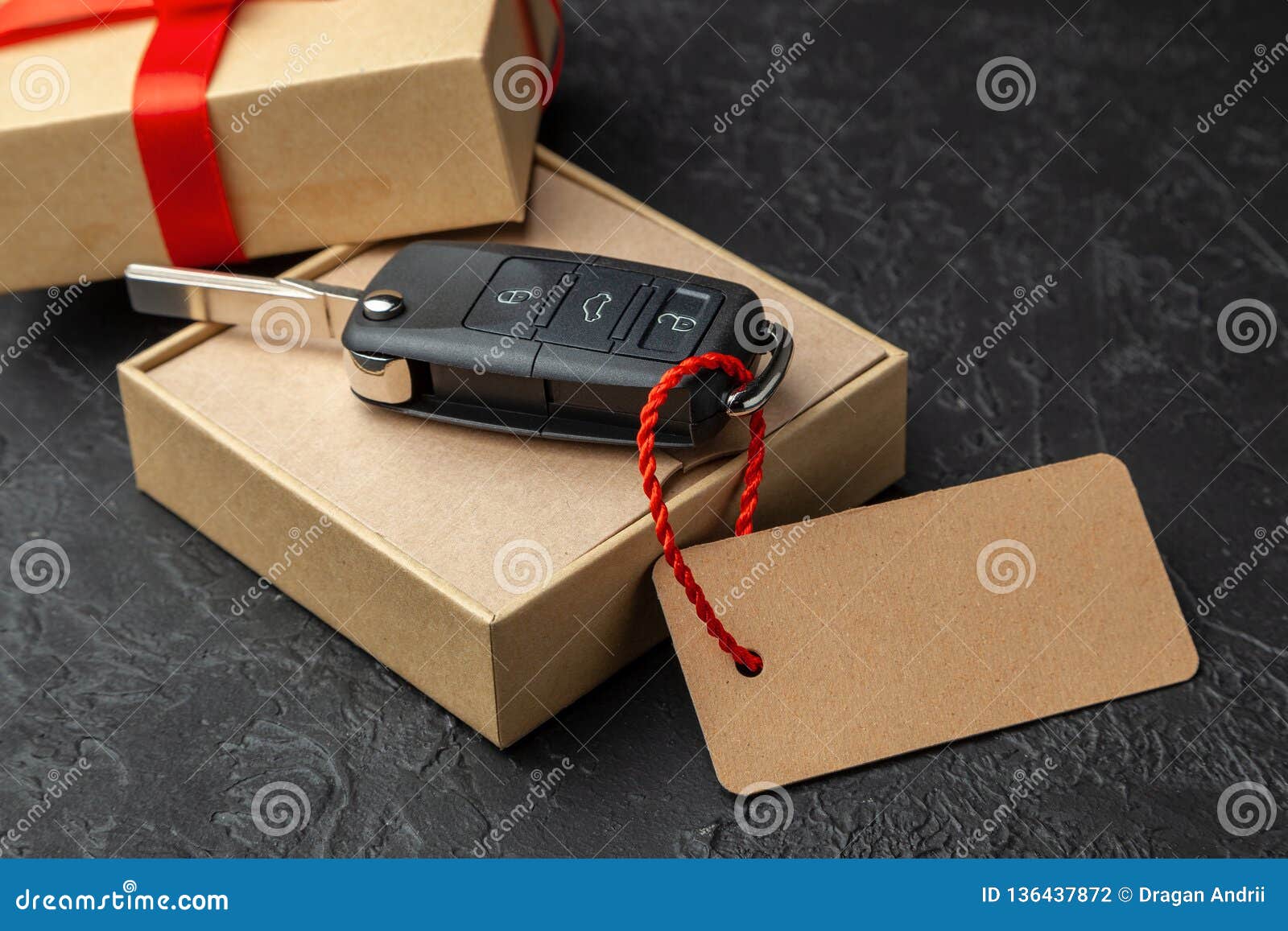 Gift Box with Car Keys with Remote Control Alarm System with Red Ribbon ...