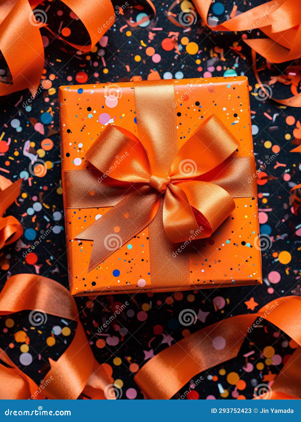 Gift Box with Orange Ribbon and Confetti on a Black Background Stock ...