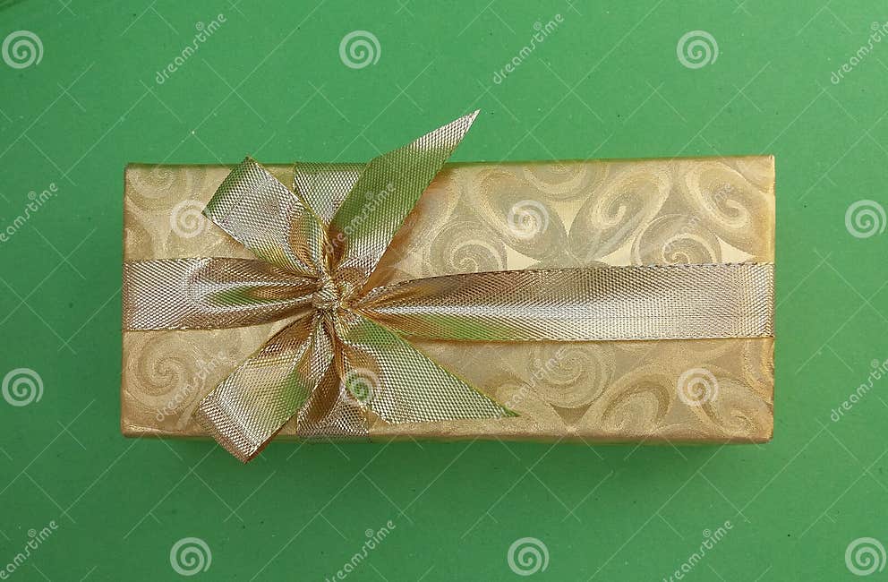 Gift Box Over Green Background Stock Image - Image of elegant, golden ...