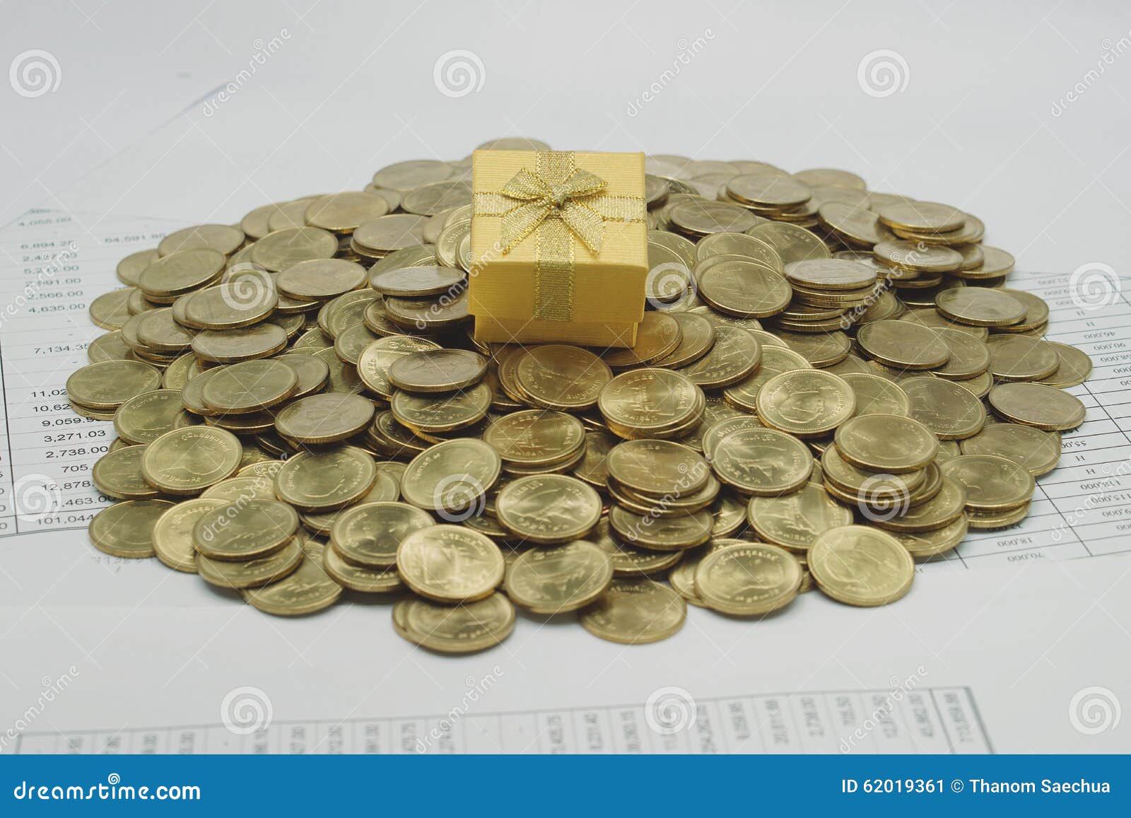 Gift Box on a Pile of Gold Coins Stock Image - Image of pile, paperwork ...