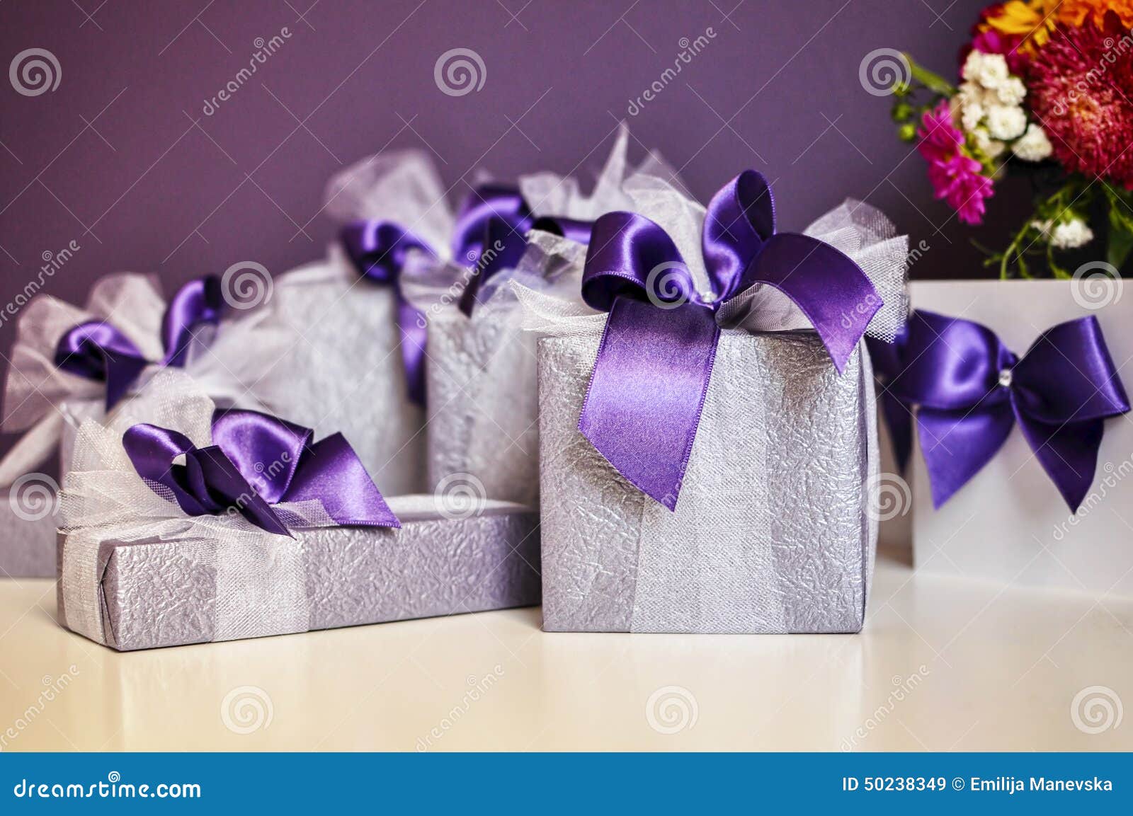 Gift Box with Purple Bows on White Table Stock Image - Image of ...