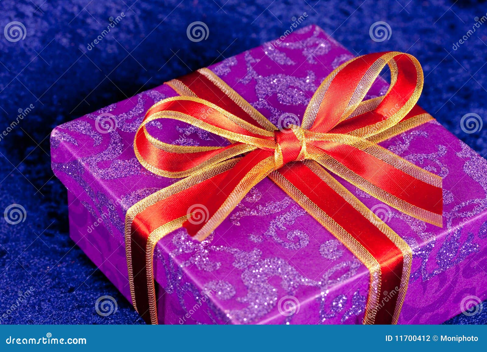 A Gift Box,with Red Ribbon, on Blue Stock Photo - Image of december ...