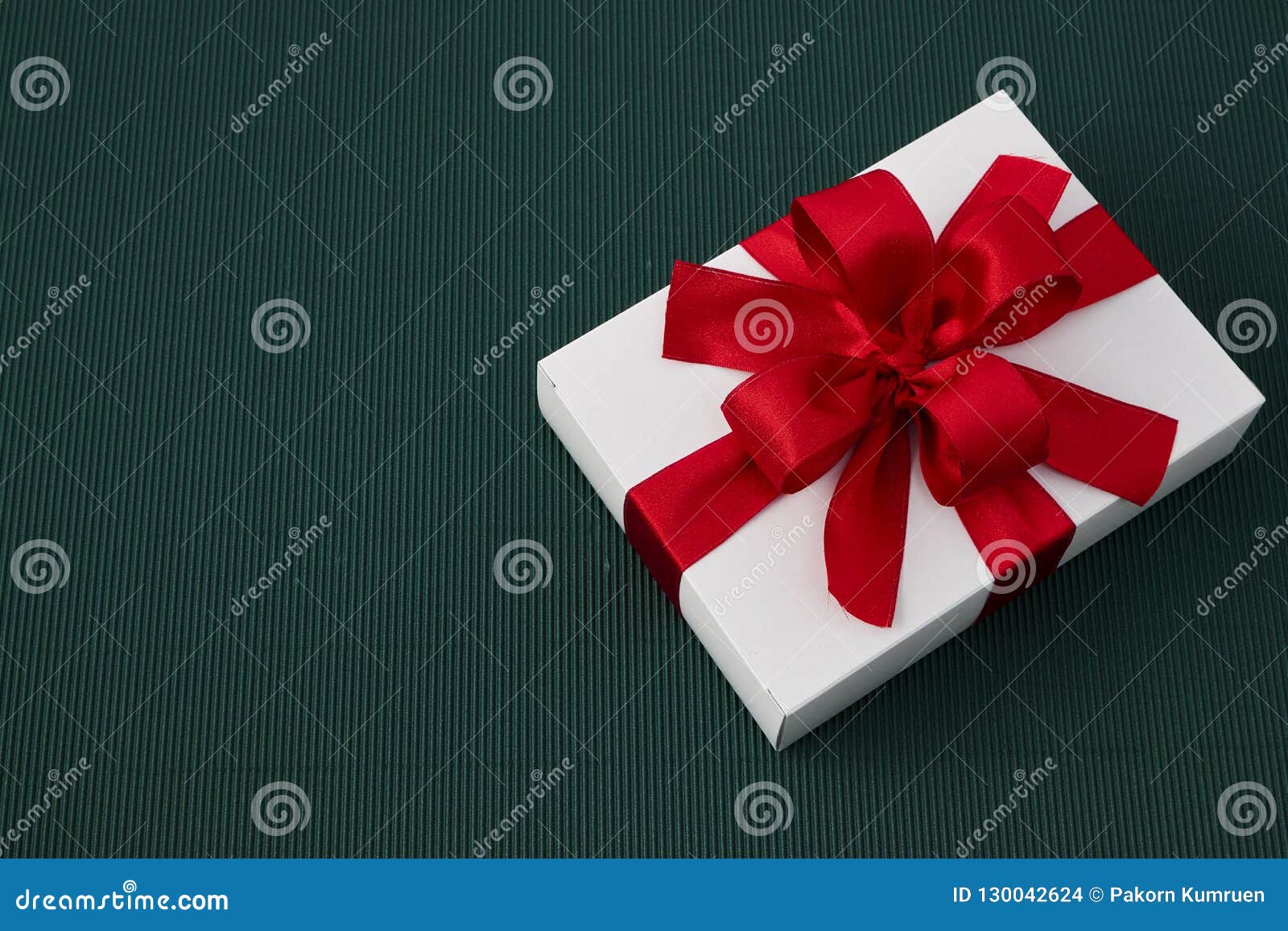 Red Ribbon And Green Wrapping Paper Texture Close Up. Stock Image ...