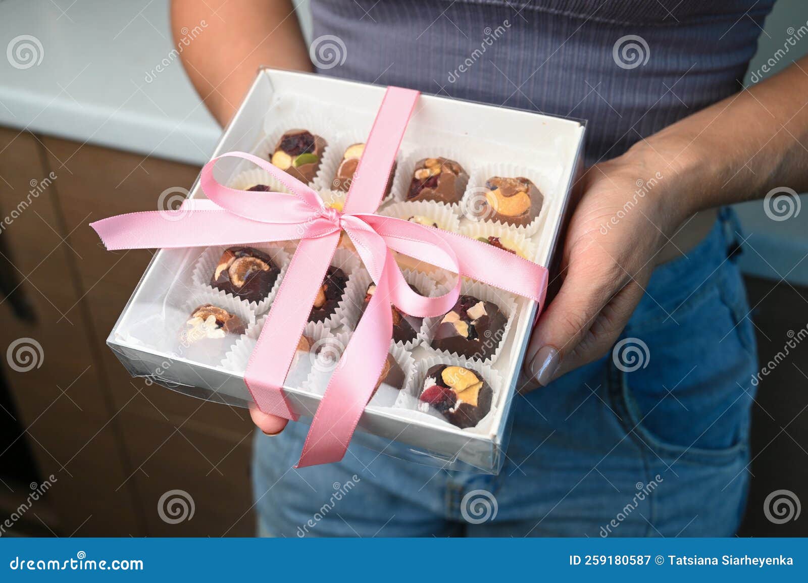 Gift Box with a Set of Assorted Chocolates in Female Hands. Celebratory ...