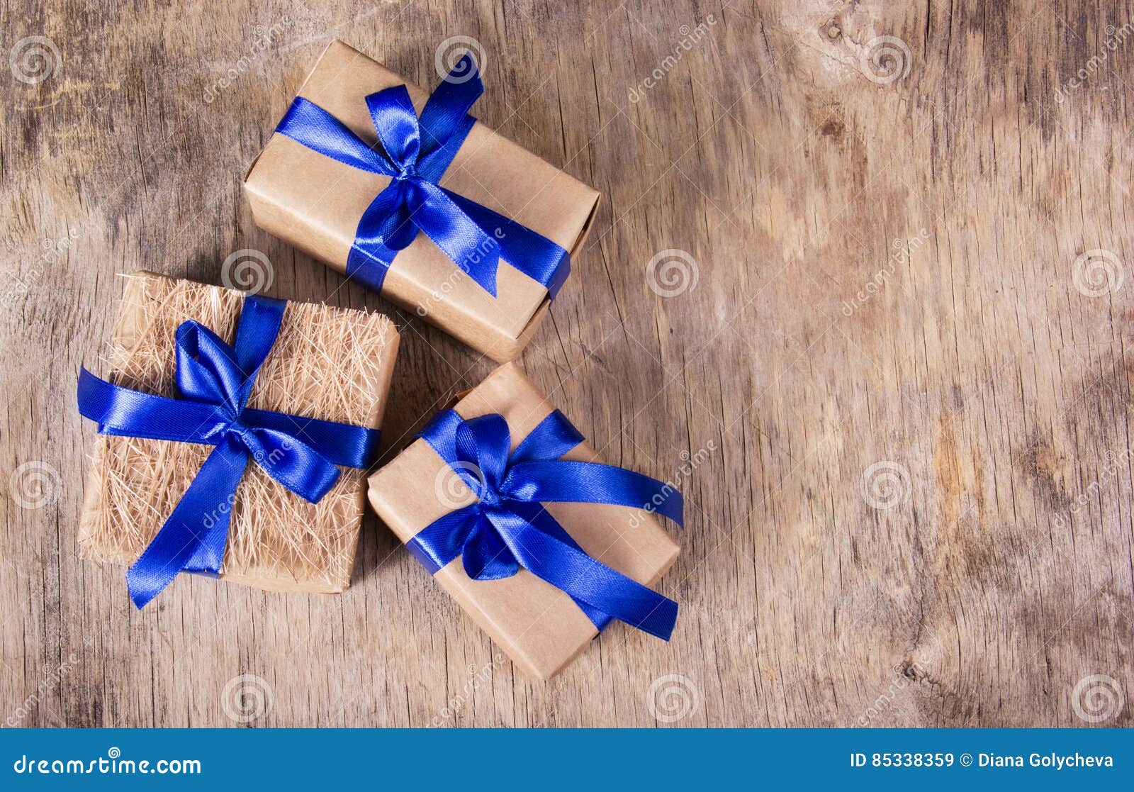 Gift Boxes with Blue Ribbons on the Old Wooden Background. Copy Space ...