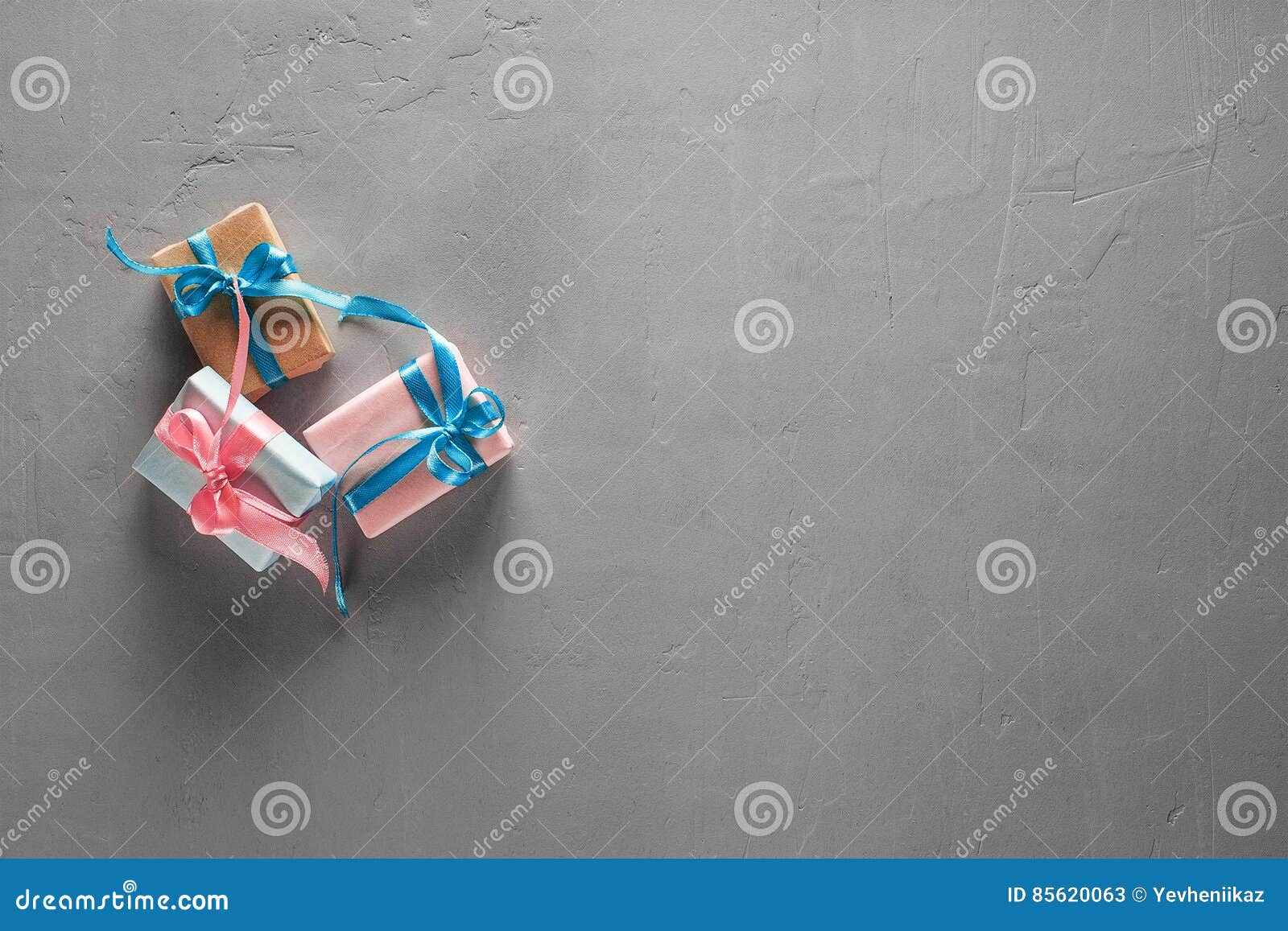 Gift Boxes in Craft Paper on a Concrete Background Stock Image - Image ...
