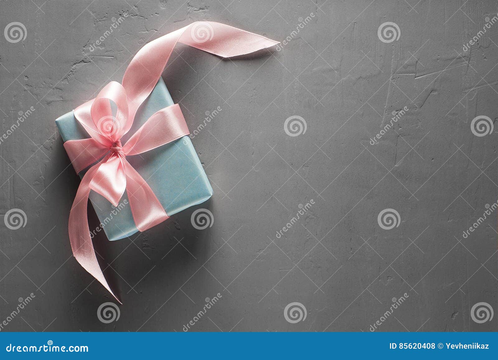 Gift Boxes in Craft Paper on a Concrete Background Stock Photo - Image ...