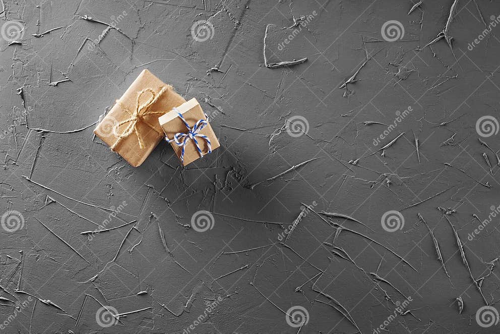 Gift Boxes in Craft Paper on Concrete Background Stock Image - Image of ...