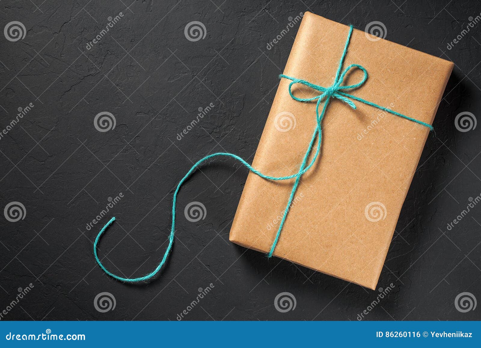 Gift Boxes in Craft Paper on a Concrete Background Stock Photo - Image ...