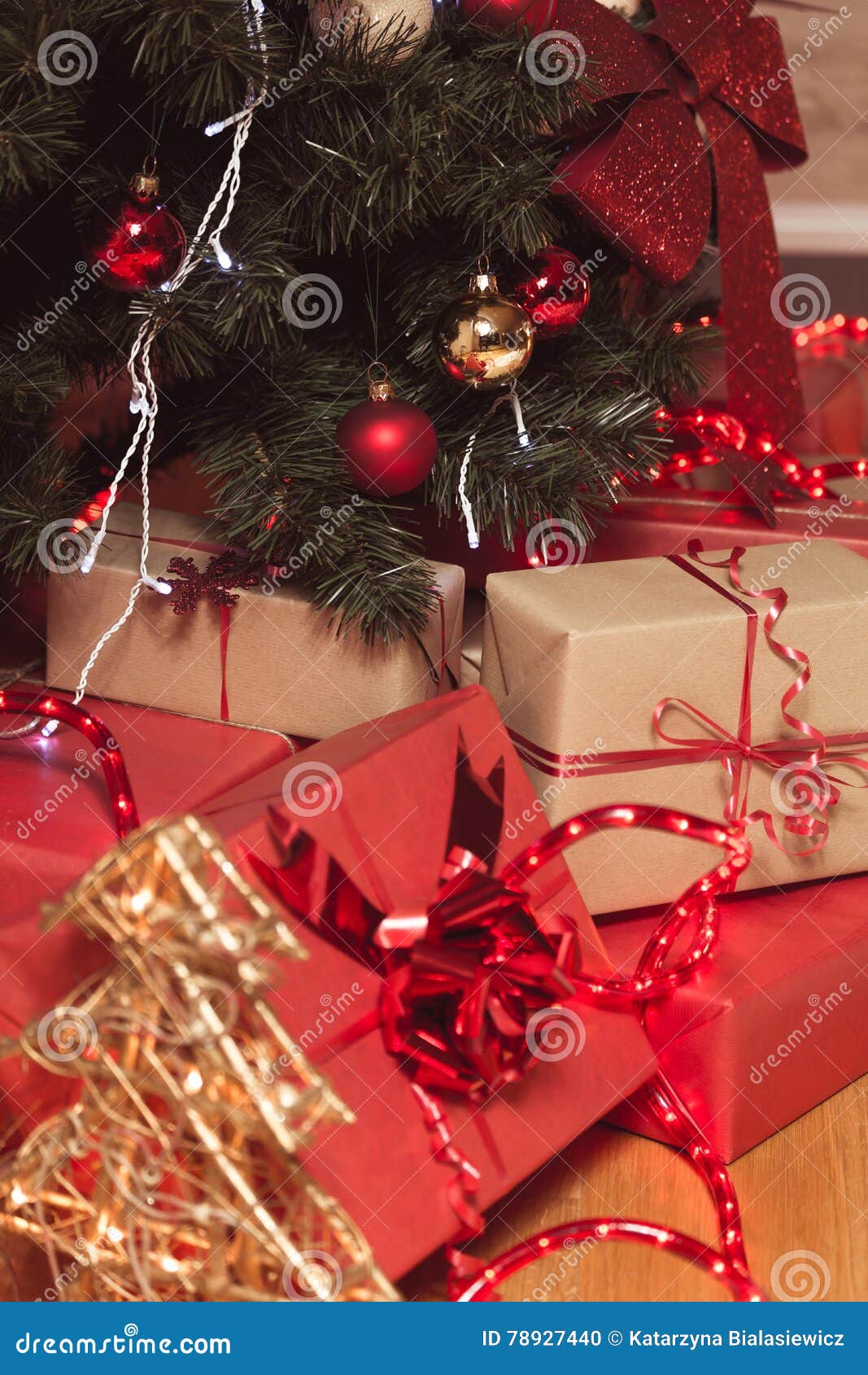 Gift Boxes Under Christmas Tree Stock Photo - Image of tradition, gold ...
