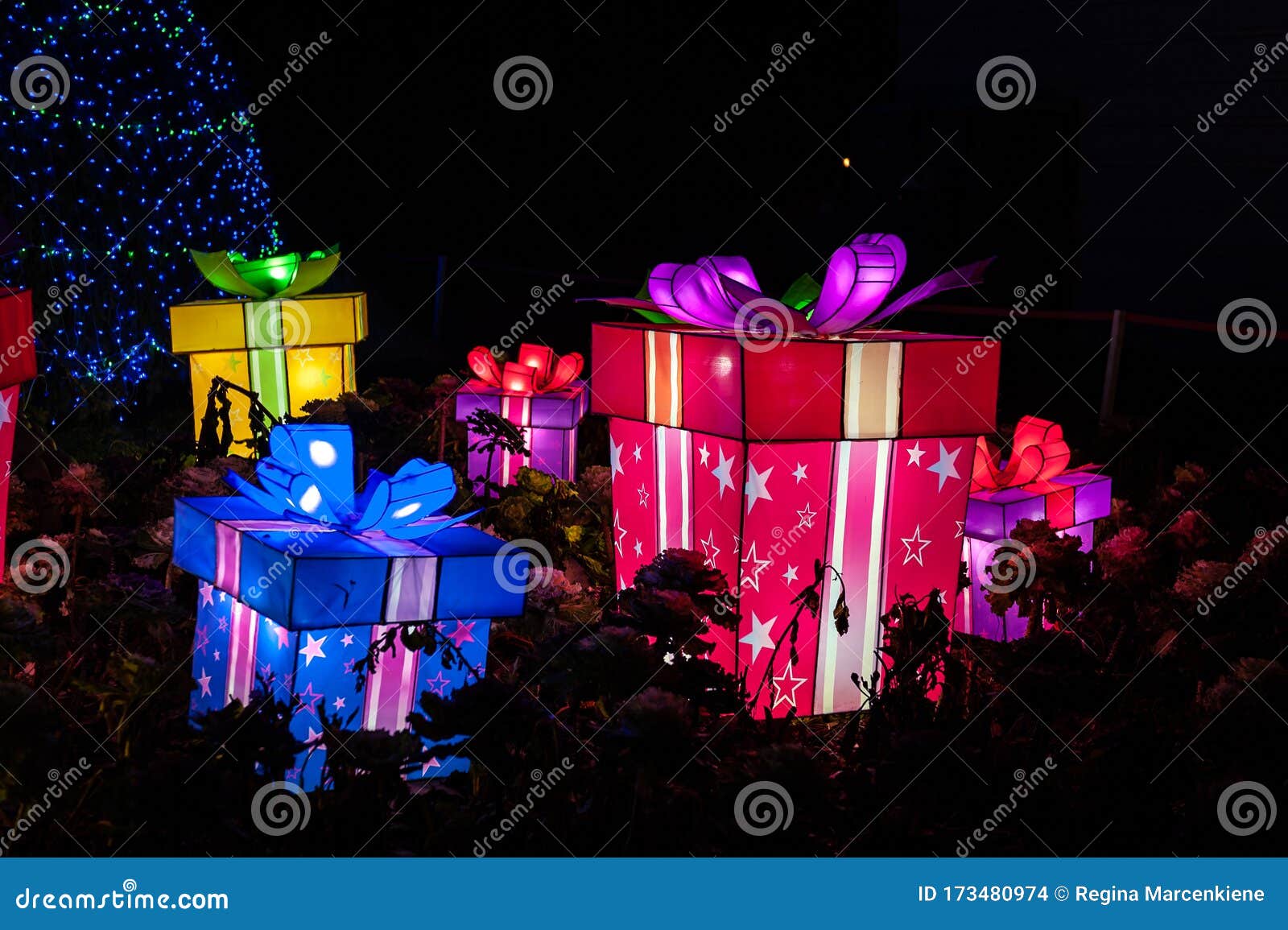 Gift Boxes Wrapped in Ripples of Many Colors Stock Photo - Image of ...