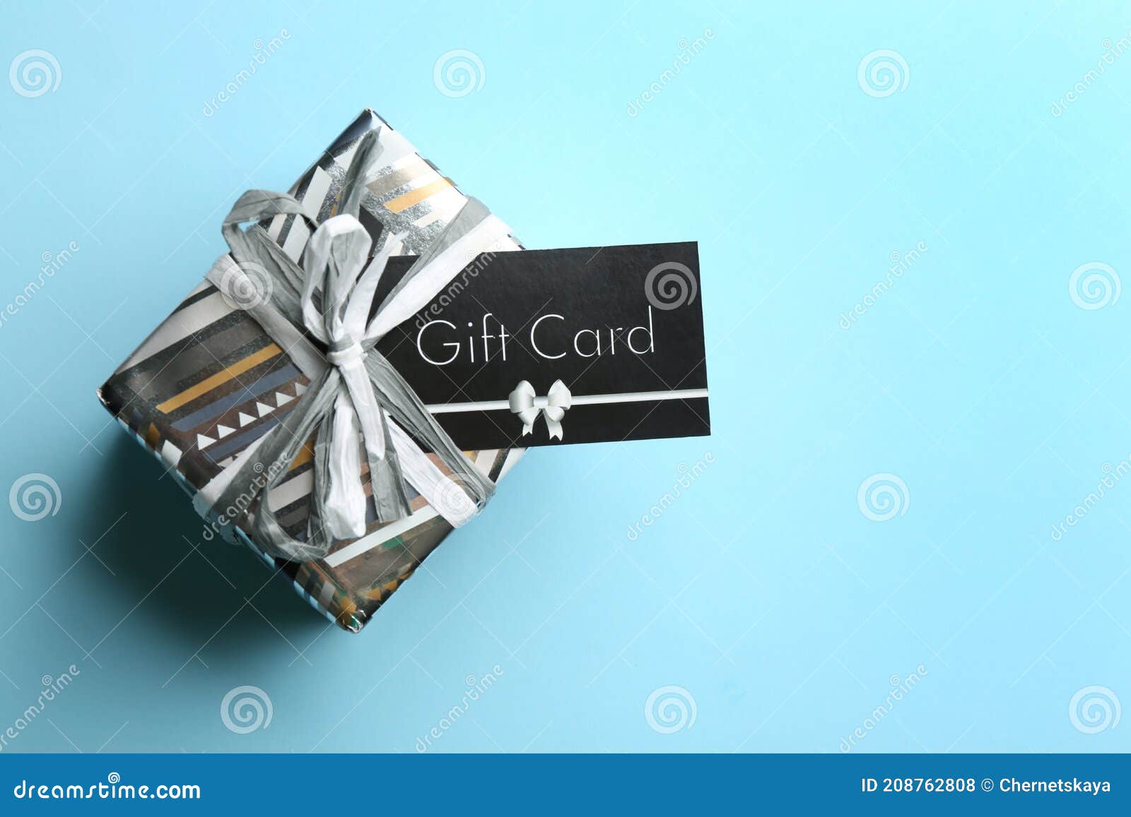 Gift Card and Present on Light Blue Background, Top View. Space for ...