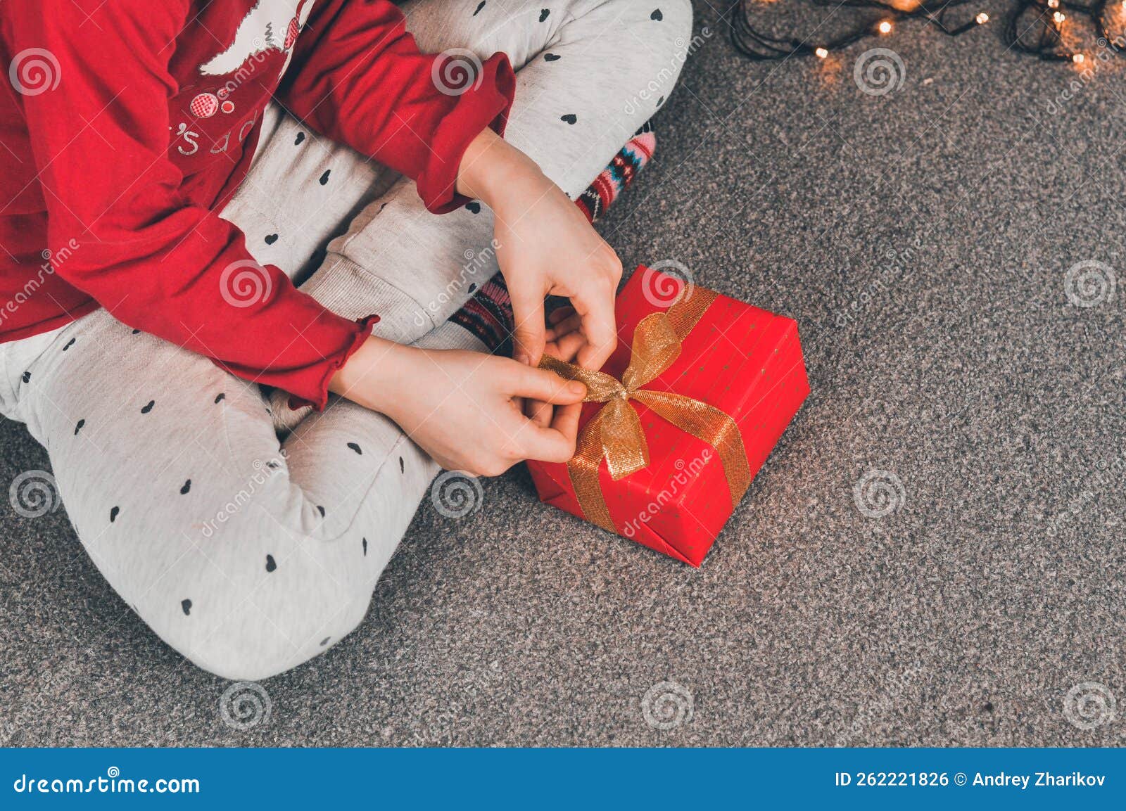 Gift. Children Unwrap Presents. a Gift Under the Christmas Tree in a ...