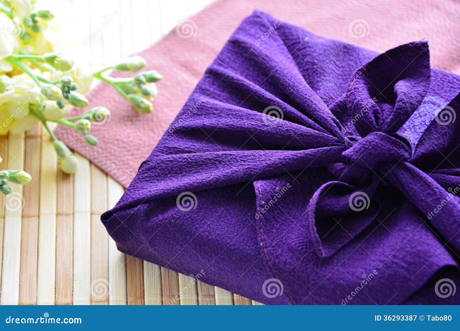 Gift in cloth wrapping stock image. Image of flower, package - 36293387
