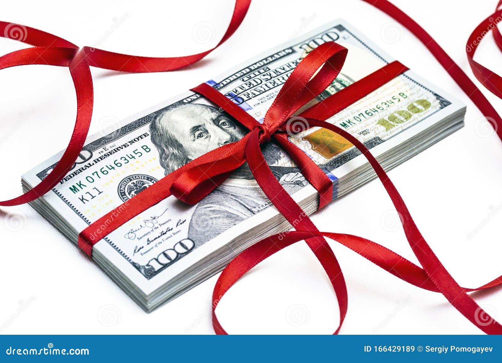 Gift of Money. Stack of Dollar Bills with Red Ribbon Isolated on White ...
