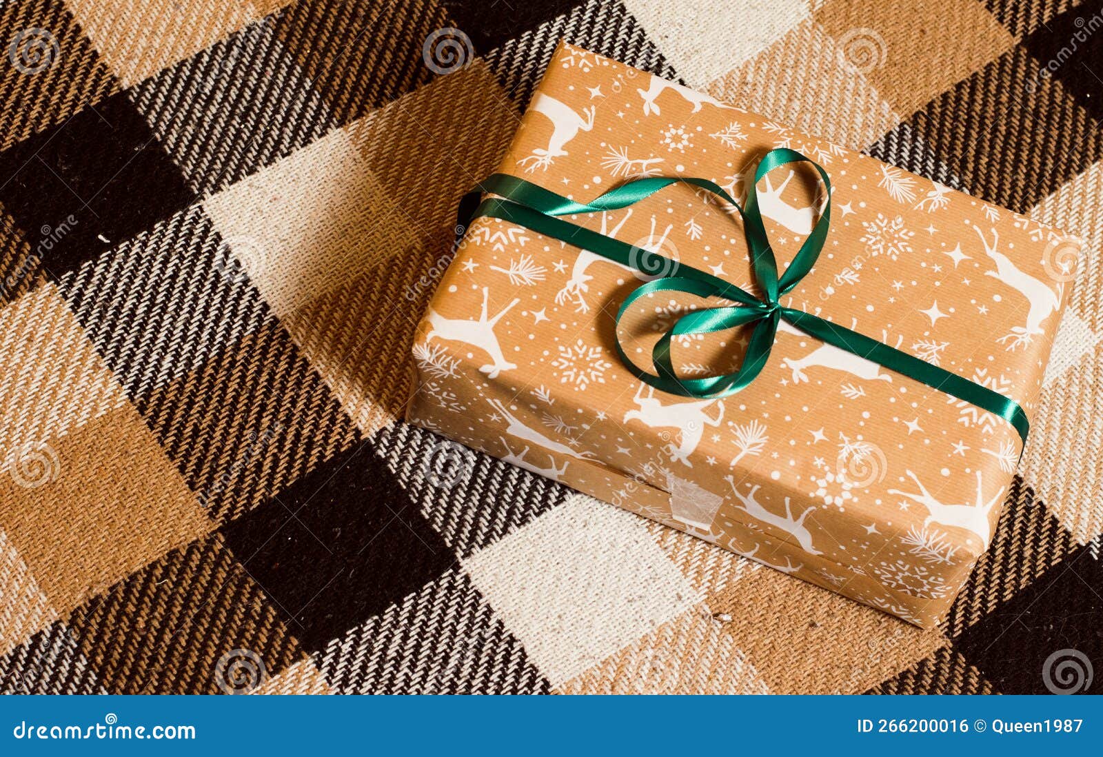 Gift Packed in Beautiful Box on Brown Plaid, Copy Space Background ...