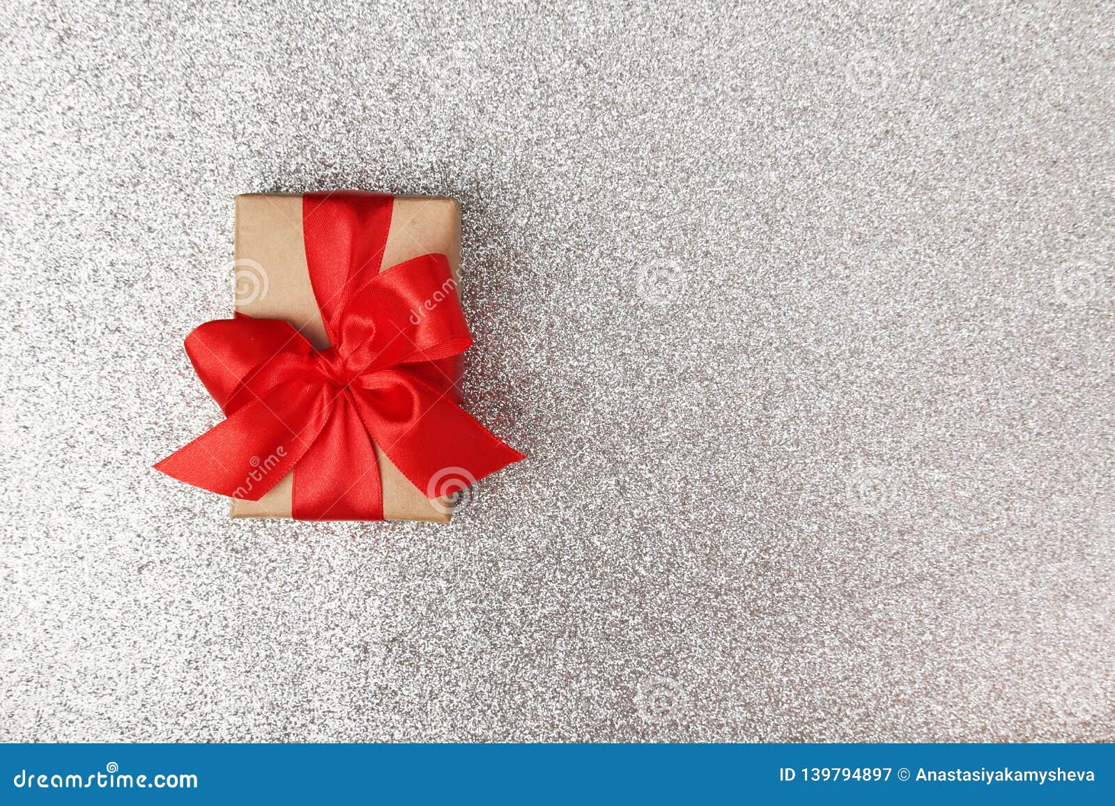 A Gift Wrapped with Craft Paper at Silver Background Stock Image ...