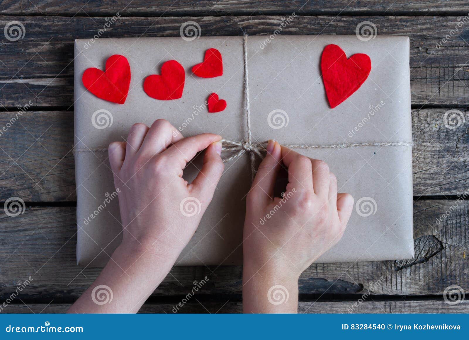 Gift Wrapped in a Kraft Paper with Red Hearts Stock Photo - Image of ...