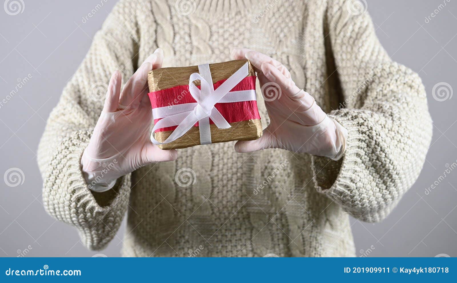Gift Wrapping with Rubber Gloves. Girl Holding Gift Wrap in Rubber ...