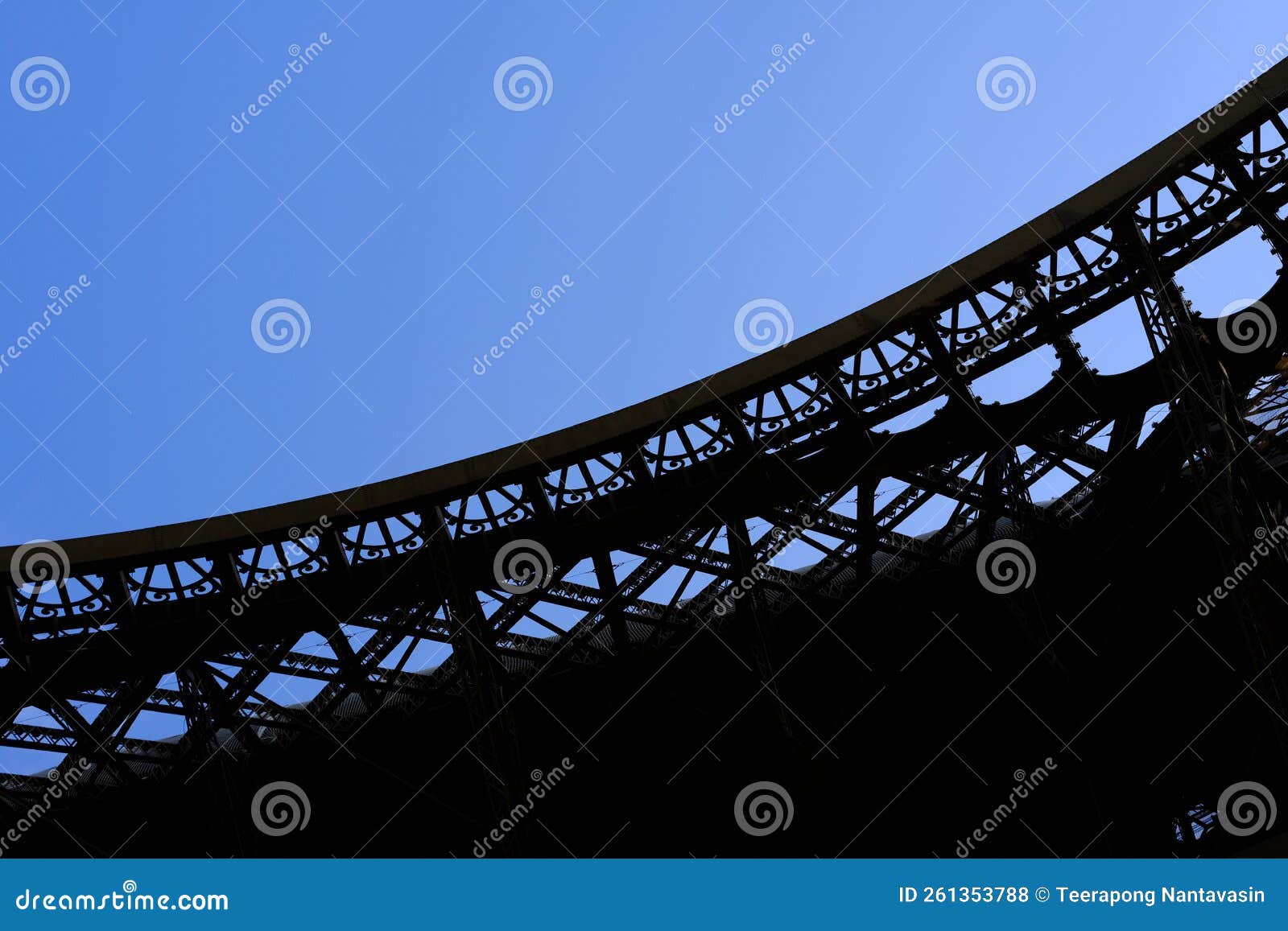 Gigantic Curve of Eiffel Tower with Blue Sky Background. Stock Photo ...