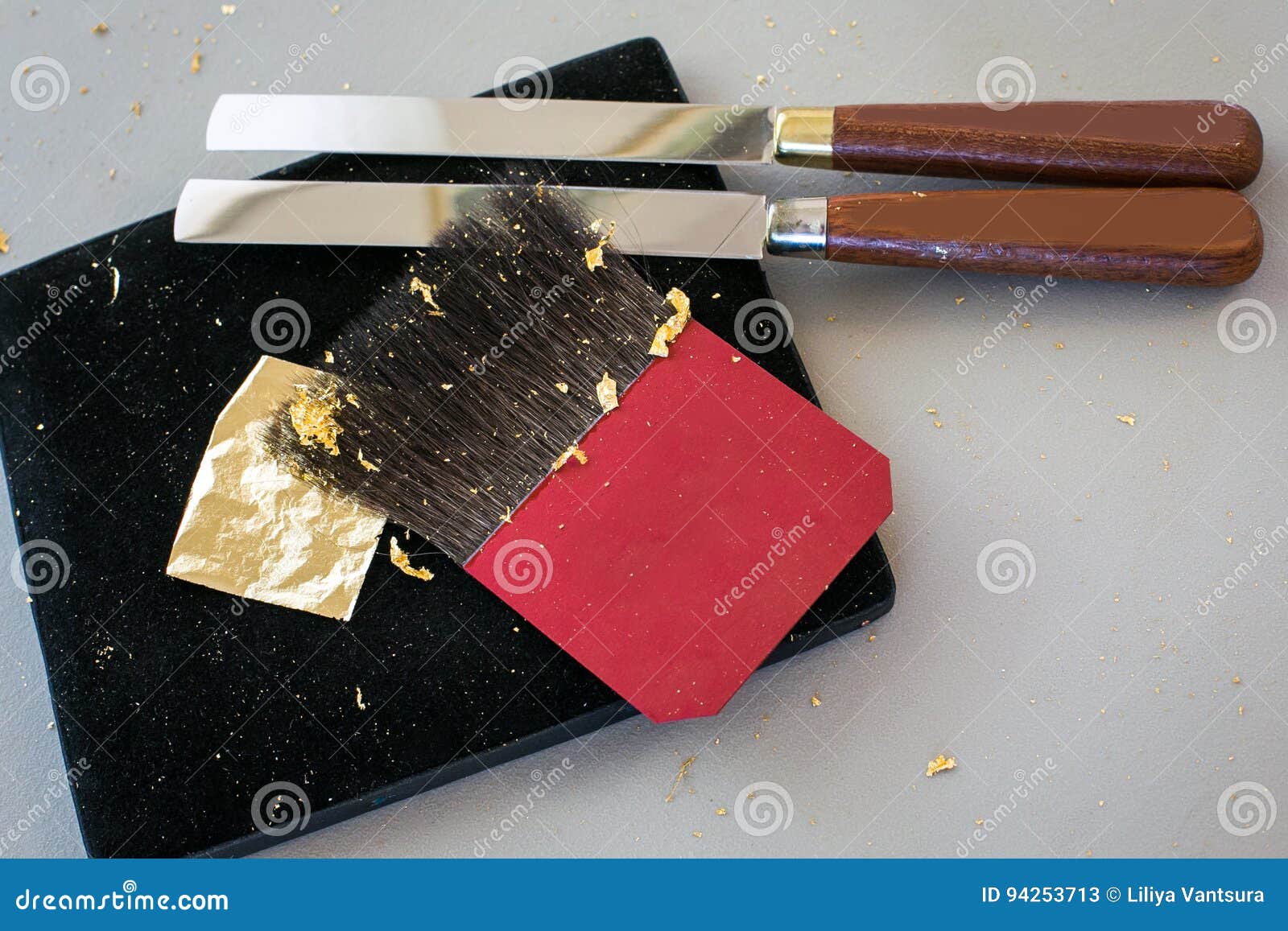 Gilding Theme with a Leaf of Beaten Gold and Blade Stock Image - Image ...