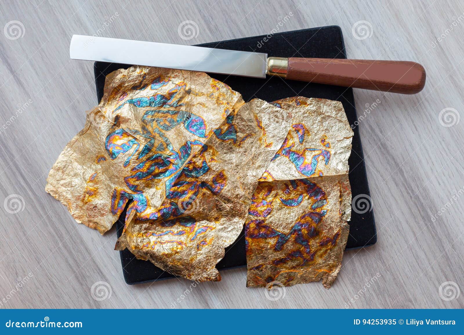 Gilding Theme with a Leaf of Beaten Gold and Blade Stock Image - Image ...