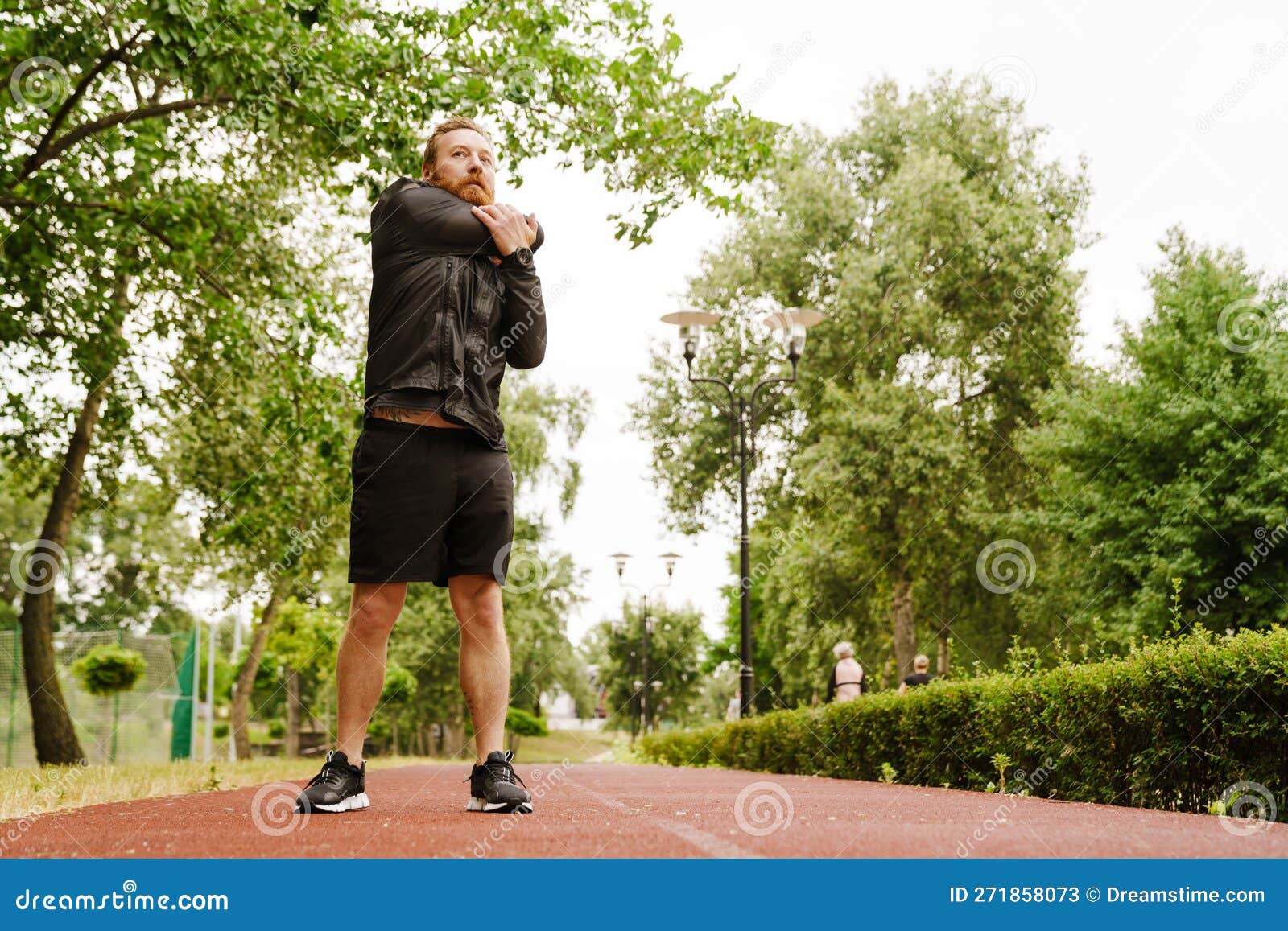 Ginger Bearded Sportsman Doing Exercise while Working Out in Park Stock ...