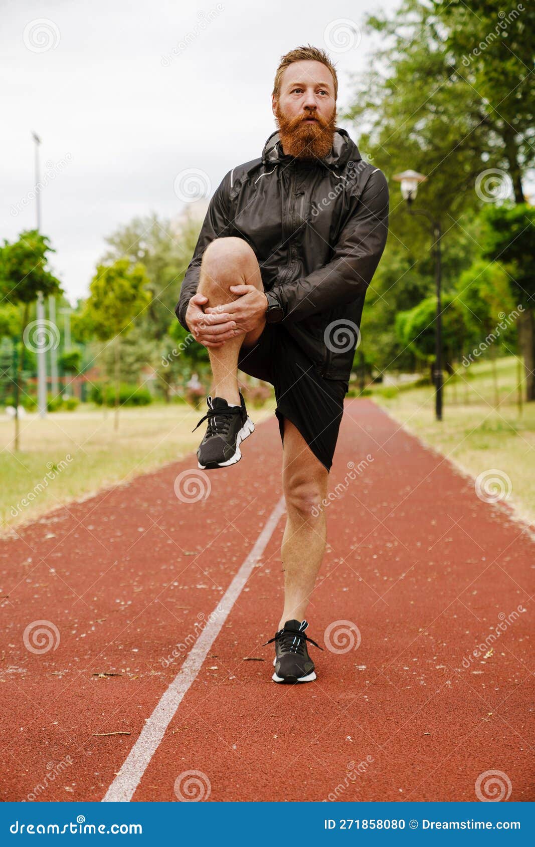 Ginger Bearded Sportsman Doing Exercise while Working Out in Park Stock ...