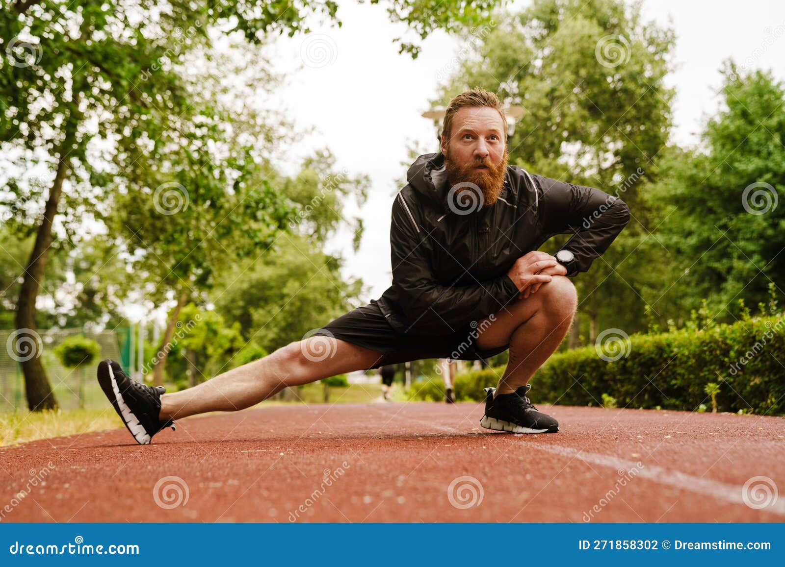Ginger Bearded Sportsman Doing Exercise while Working Out in Park Stock ...
