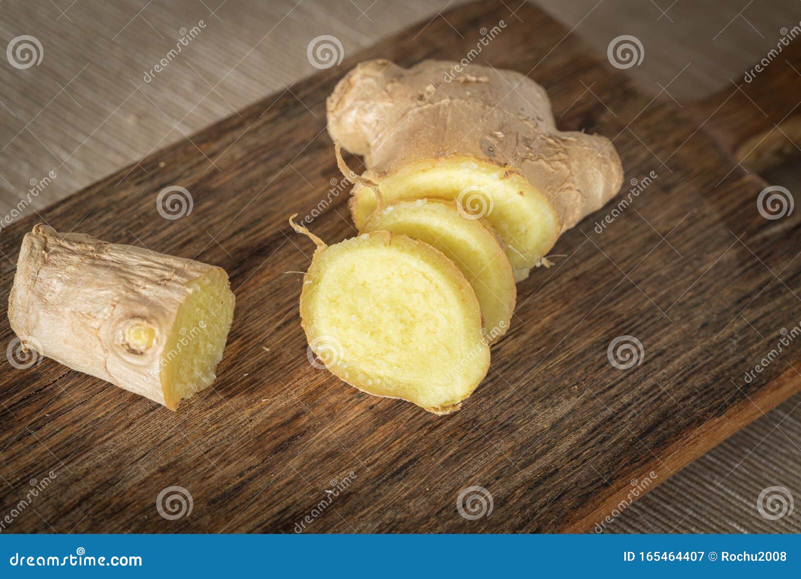Ginger Chopped and in a Large Piece on a Chopping Board in the Kitchen ...
