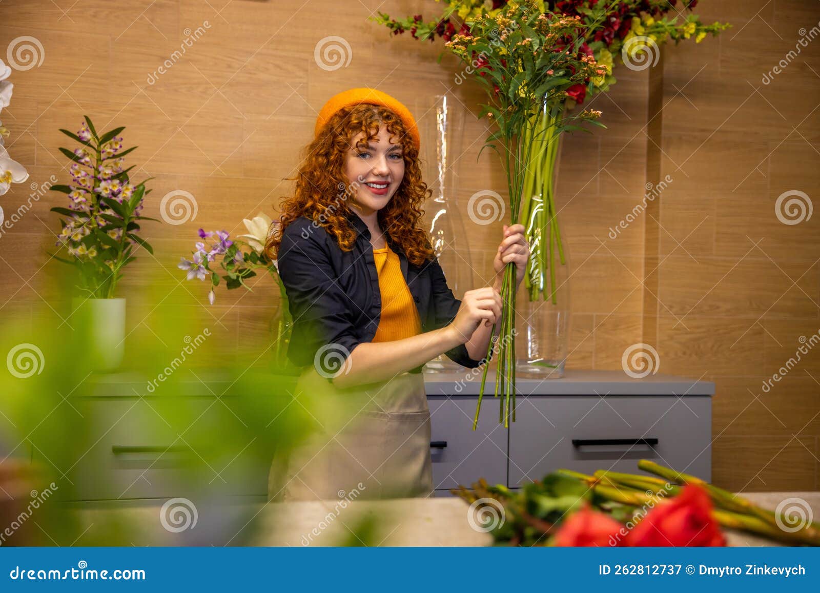 Ginger Girl Sorting Flowers and Looking Contented Stock Image - Image ...