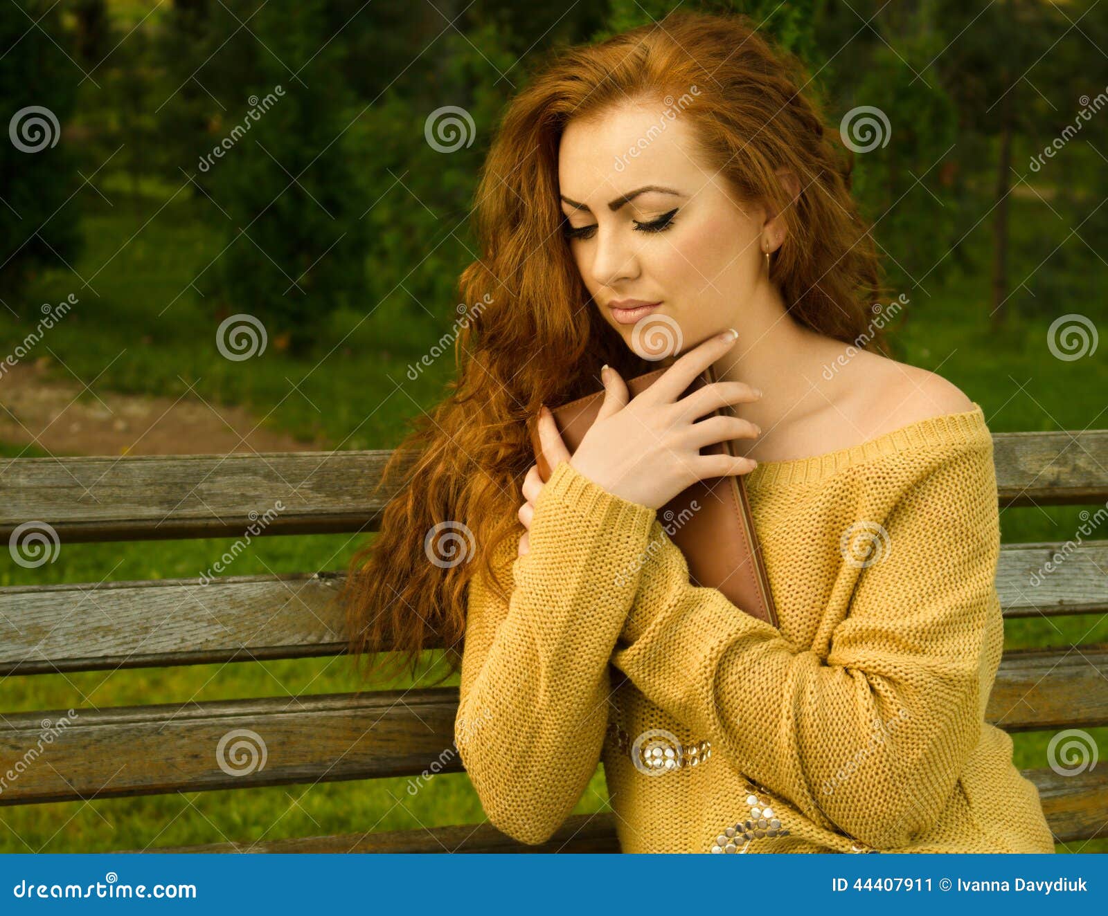 Ginger Haired Woman Sitting On A Bench With Book Stock Image Image Of