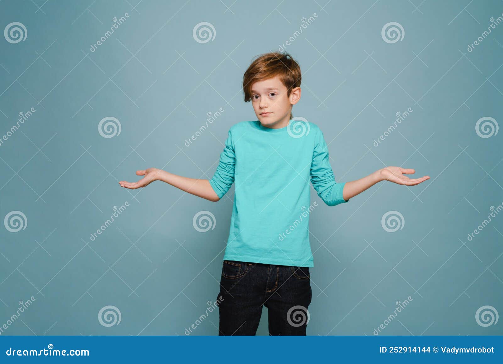 Ginger Perplexed Boy Gesturing and Looking at Camera Stock Photo ...