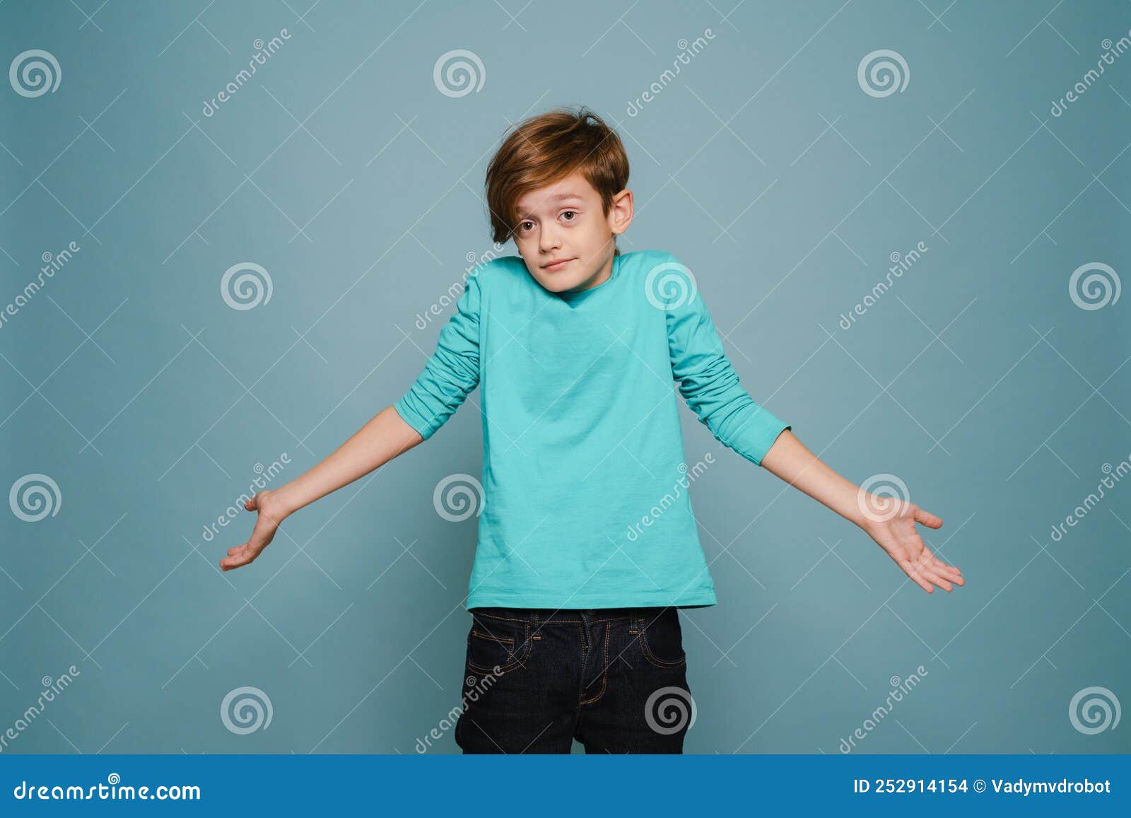 Ginger Perplexed Boy Gesturing and Looking at Camera Stock Photo ...