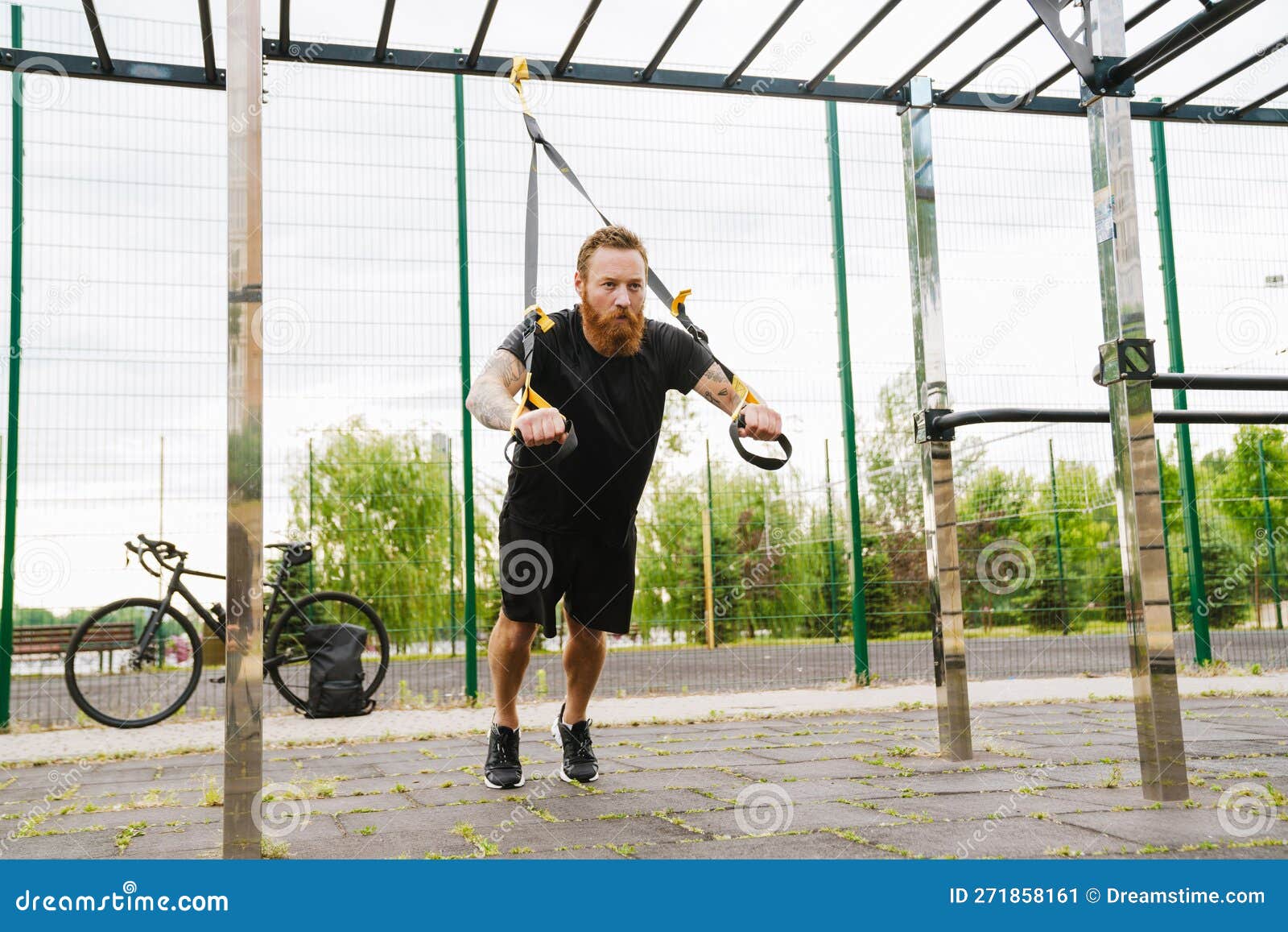 Ginger Sportsman Doing Exercise while Working Out on Playground Stock ...