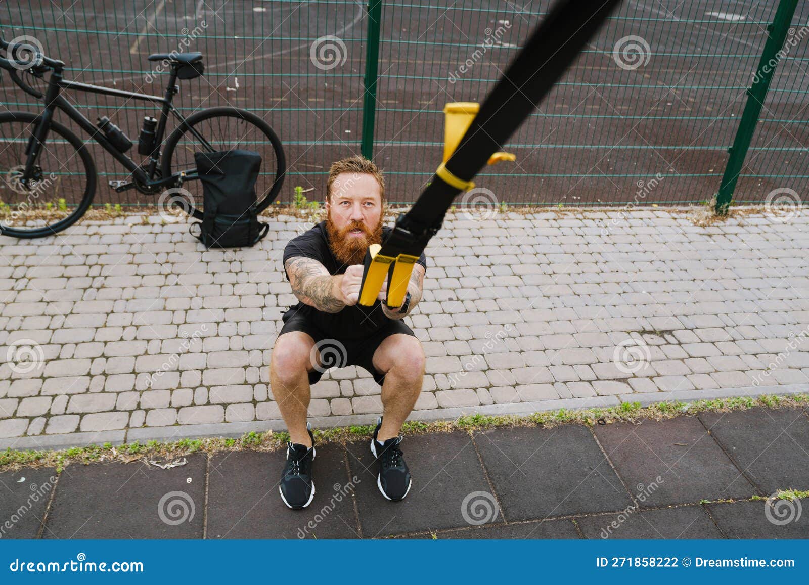 Ginger Sportsman Doing Exercise while Working Out on Playground Stock ...
