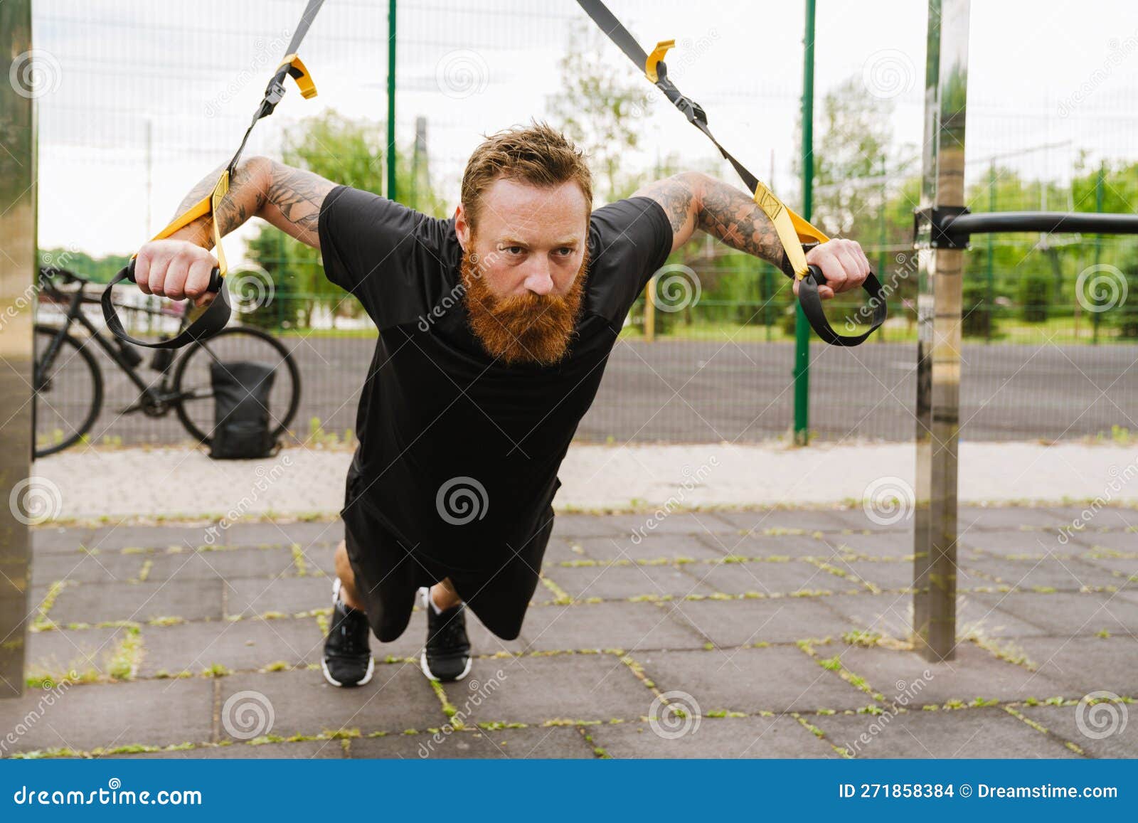 Ginger Sportsman Doing Exercise while Working Out on Playground Stock ...