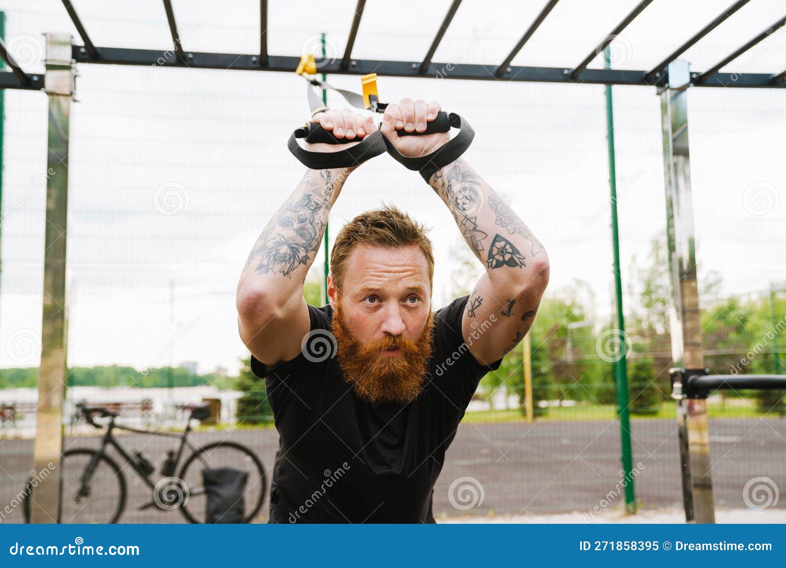 Ginger Sportsman Doing Exercise while Working Out on Playground Stock ...