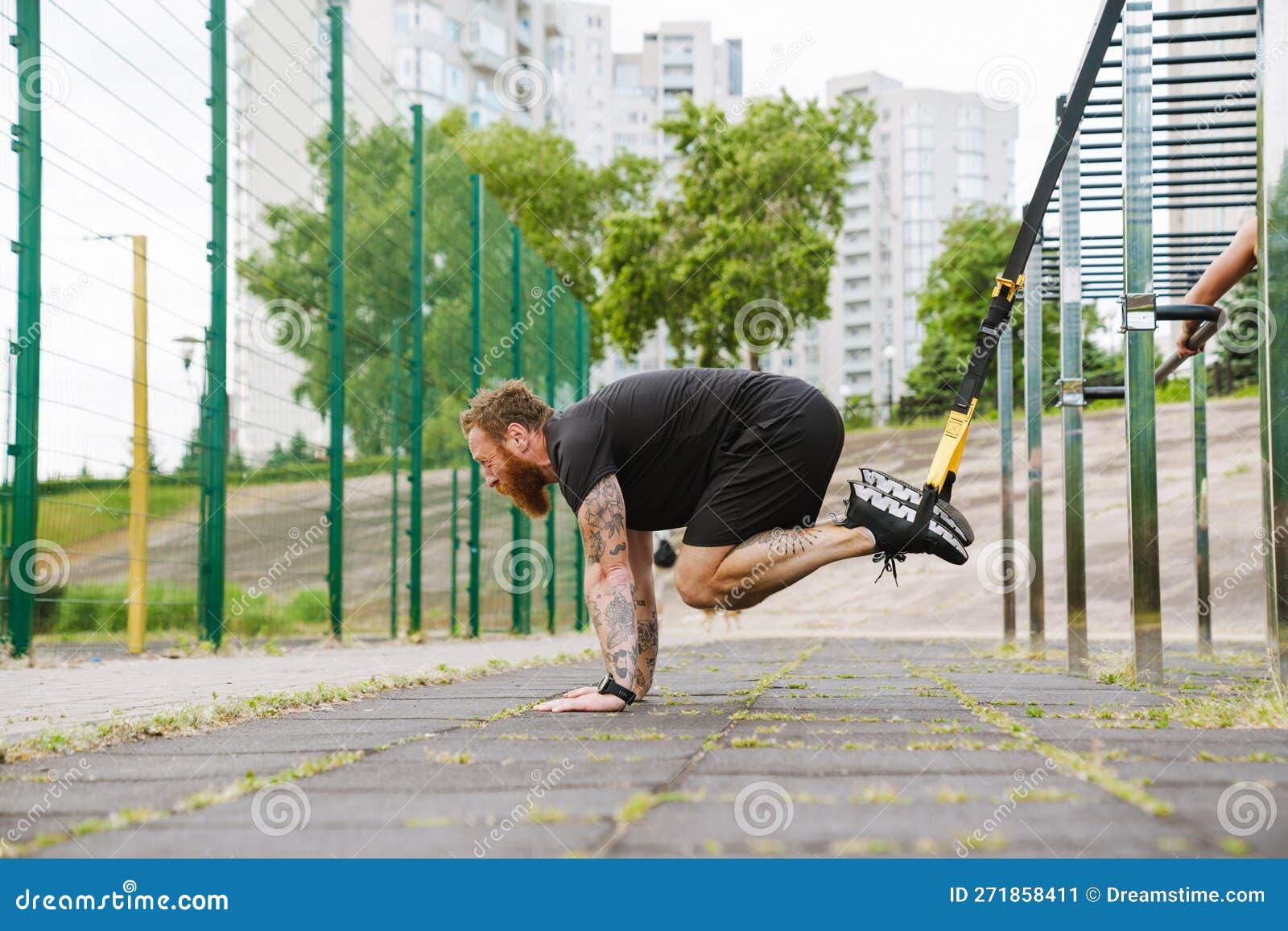 Ginger Sportsman Doing Exercise while Working Out on Playground Stock ...