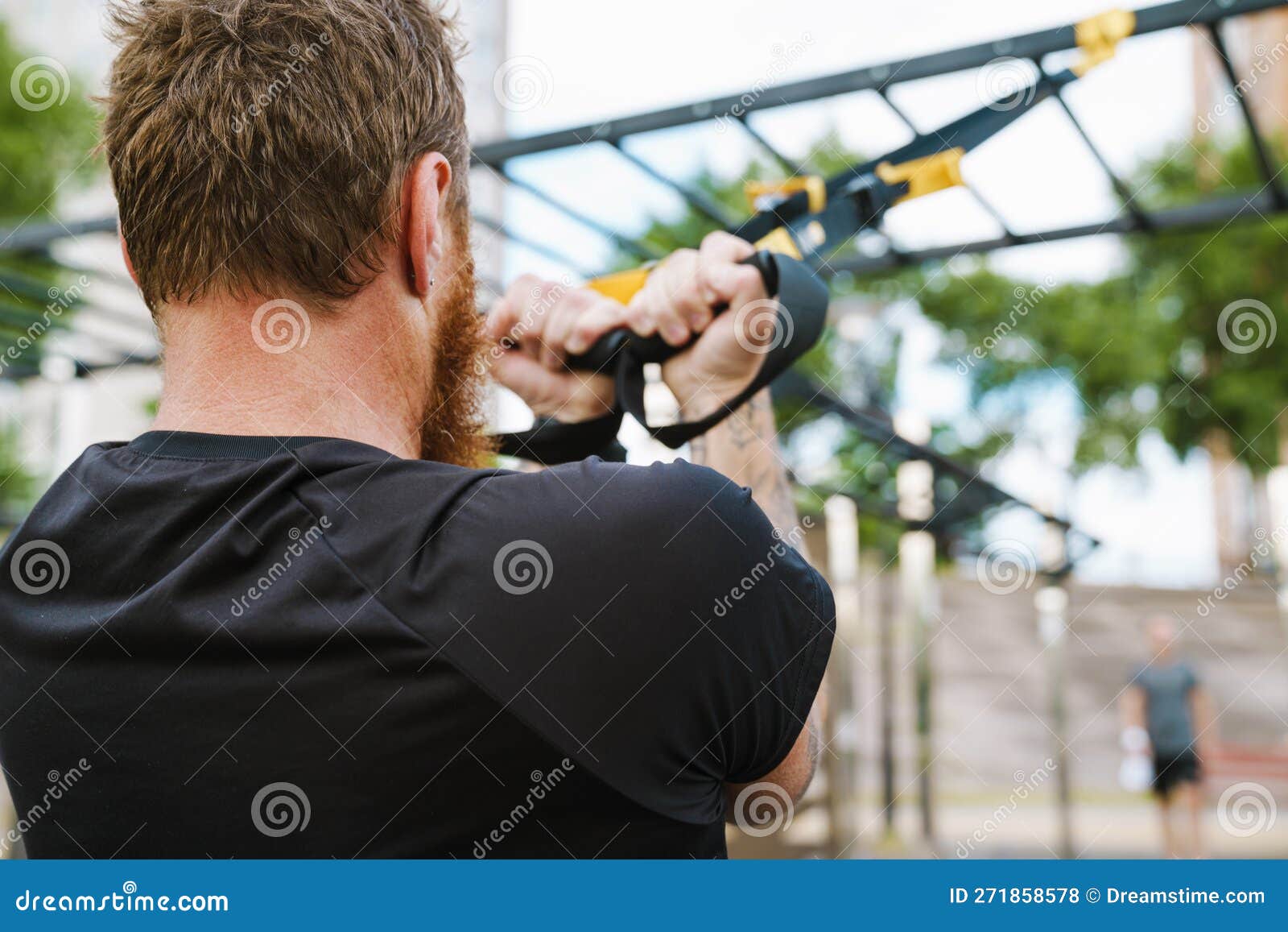 Ginger Sportsman Doing Exercise while Working Out on Playground Stock ...