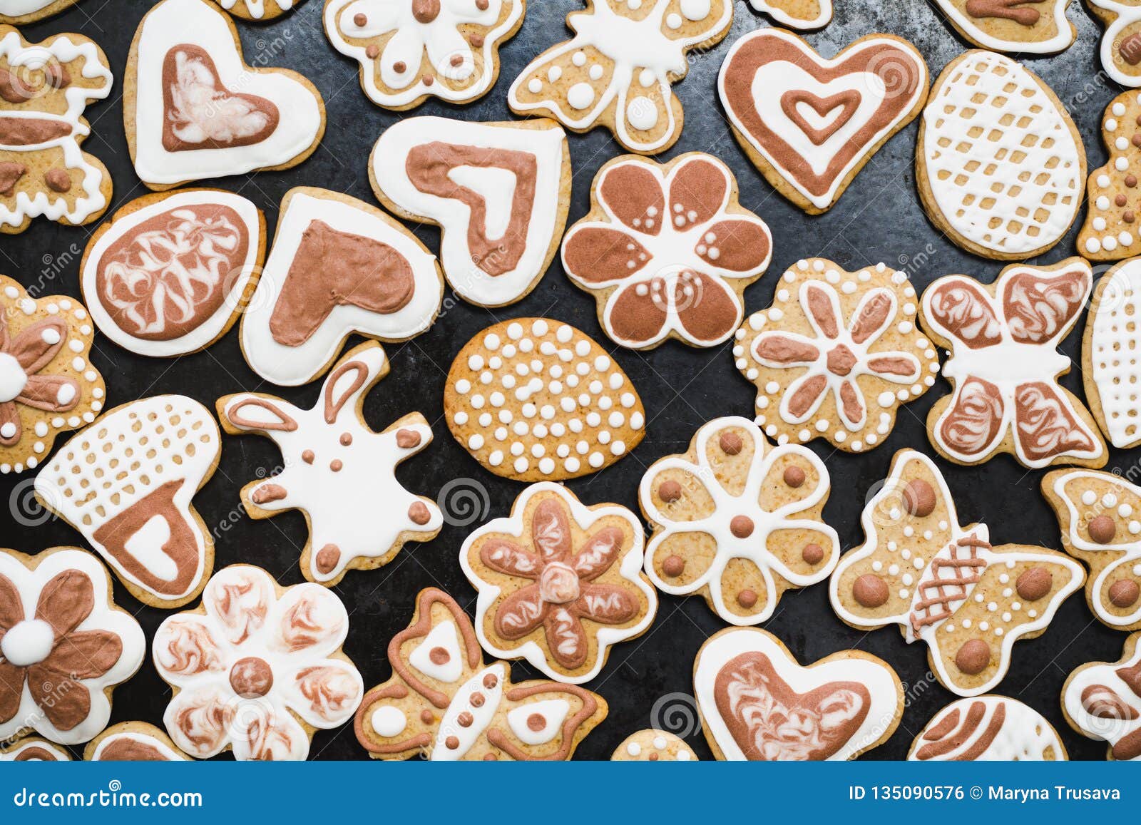 Gingerbread, Covered with White and Chocolate Icing-sugar on a Black ...