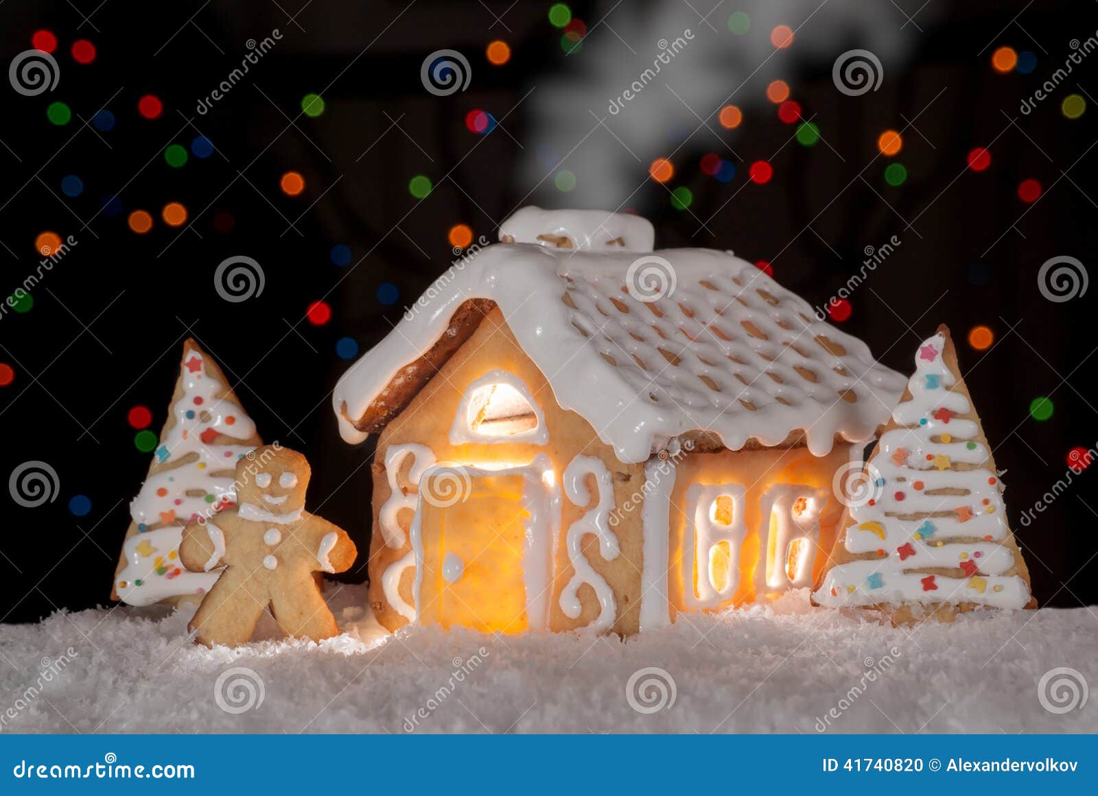 Gingerbread House with Gingerbread Man and Christmas Trees Stock Photo ...