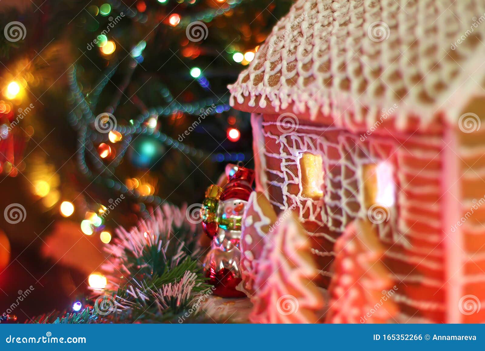 Gingerbread House with Icing. Festive Evening Tree with Lights and ...