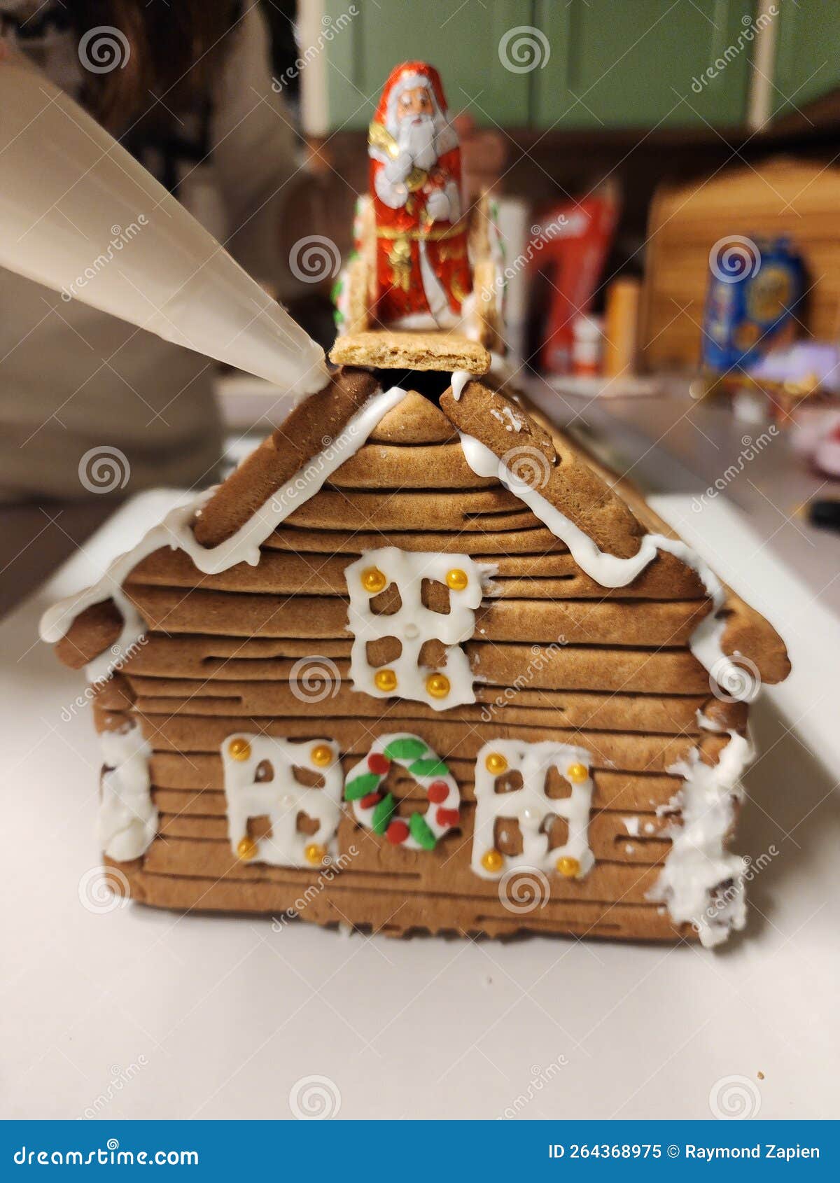 Gingerbread House with Santa on Top Stock Image - Image of buttercream ...