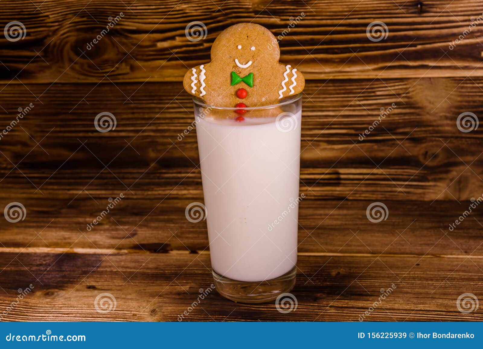 Gingerbread Man in a Glass of Milk on Wooden Table Stock Image - Image ...
