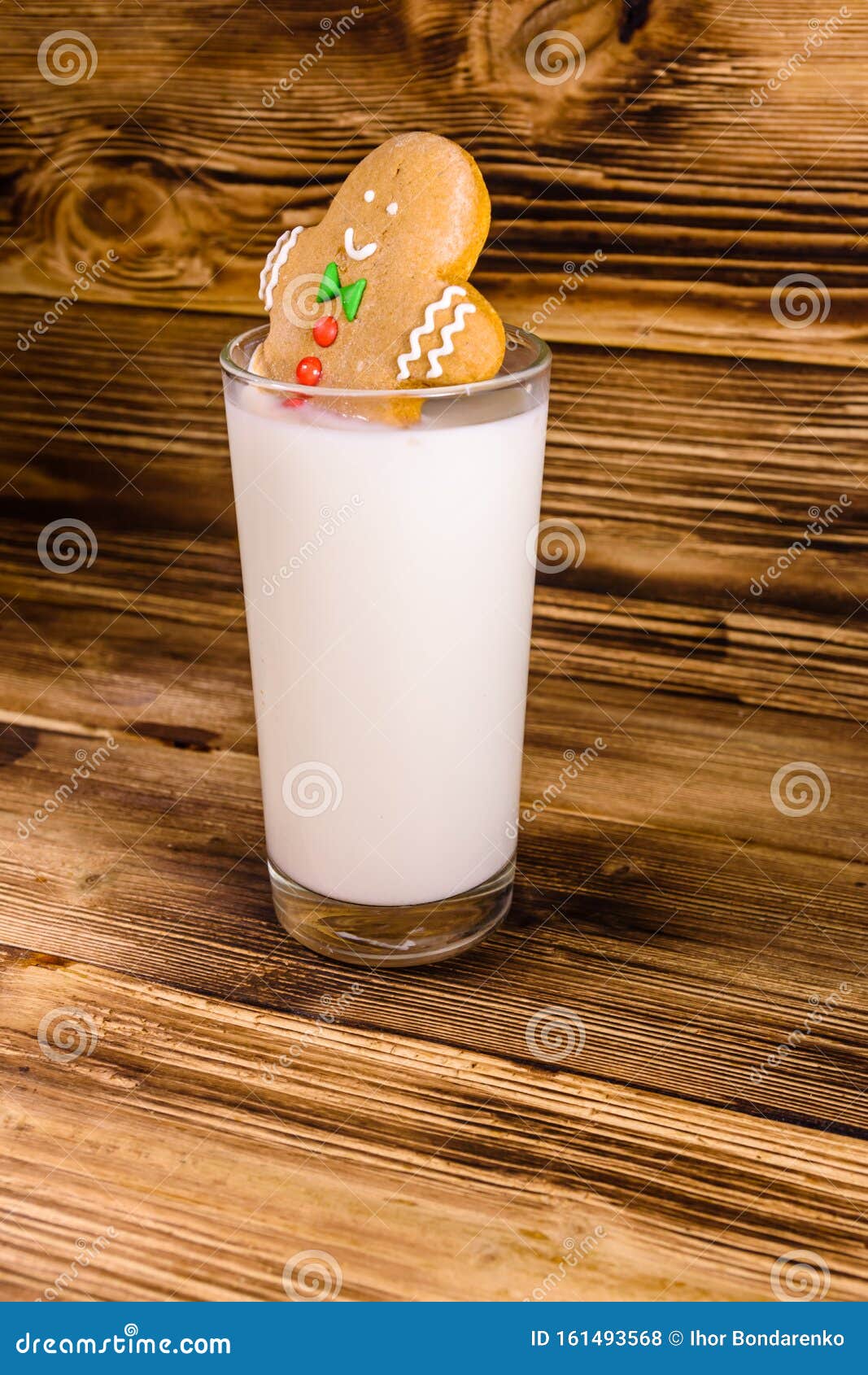 Gingerbread Man in a Glass of Milk on Wooden Table Stock Photo - Image ...