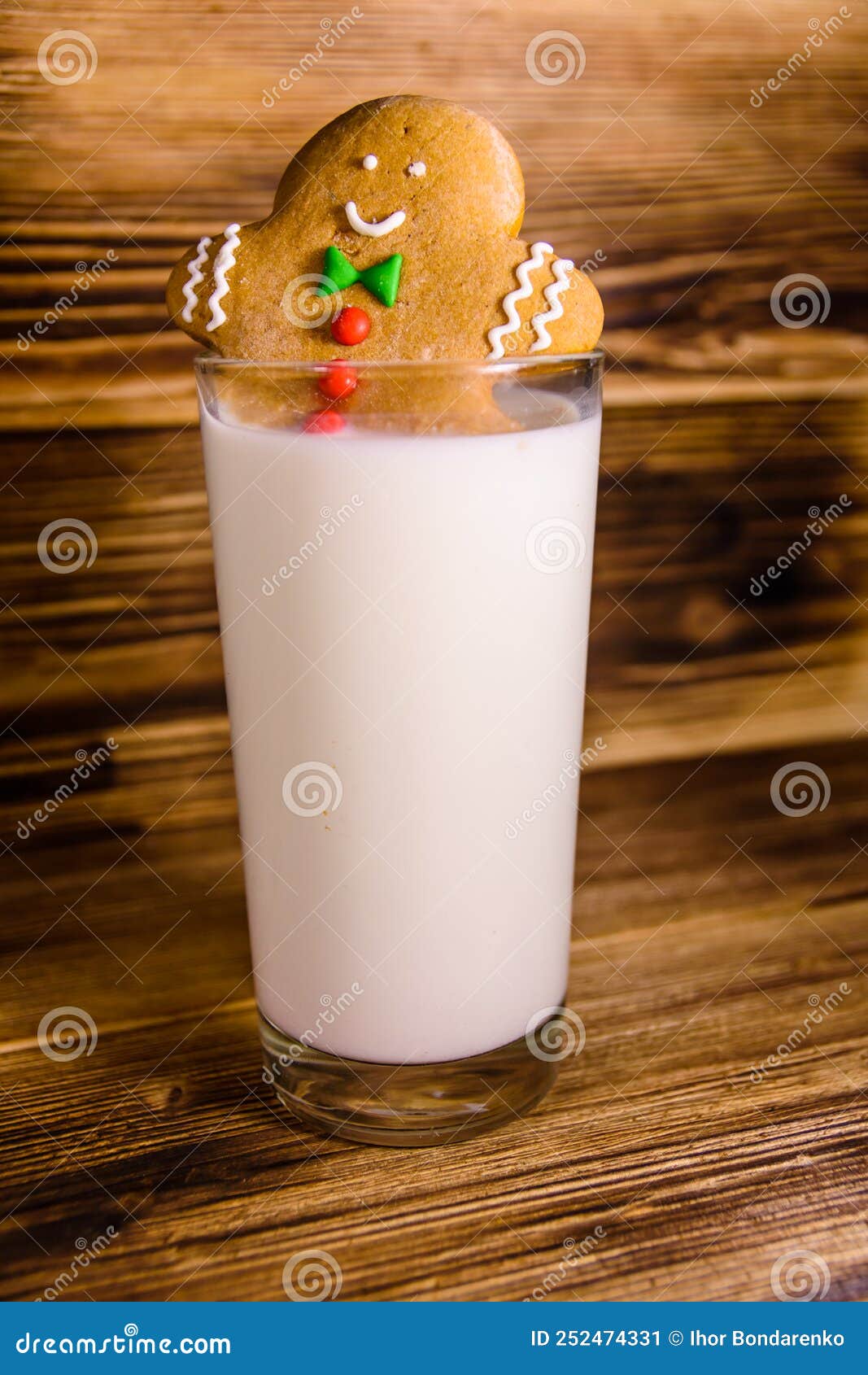 Gingerbread Man in a Glass of Milk on Wooden Table Stock Image - Image ...