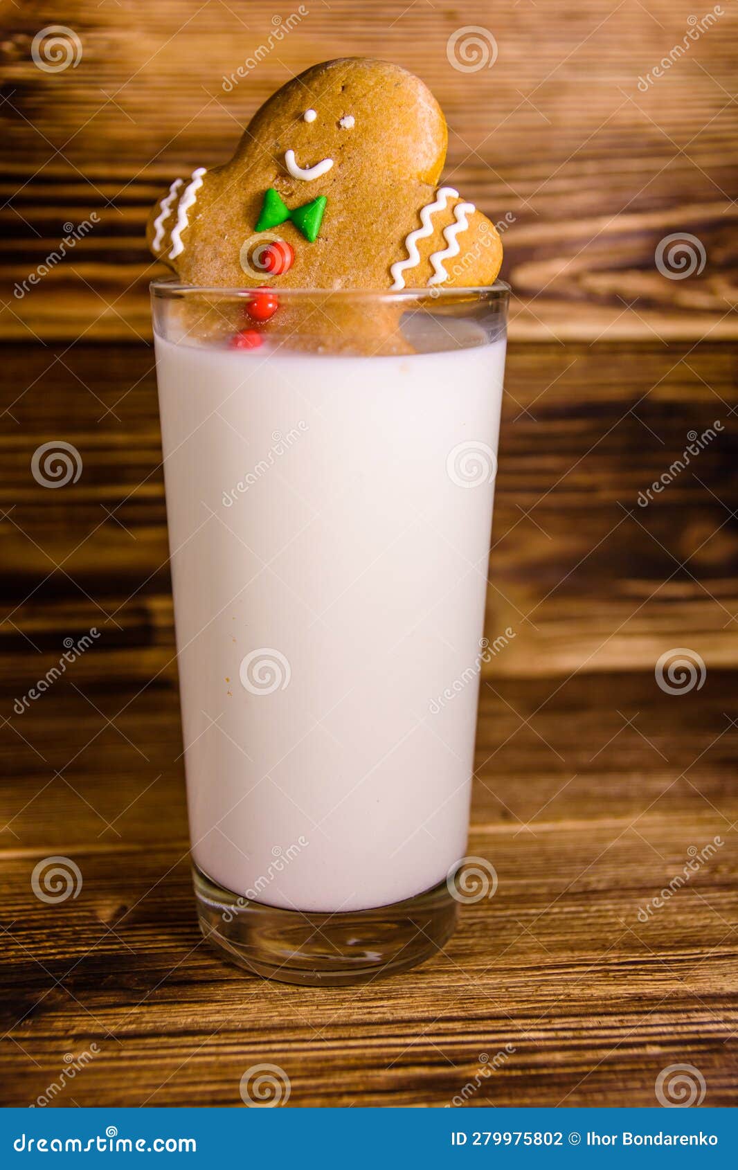Gingerbread Man in a Glass of Milk on Wooden Table Stock Photo - Image ...