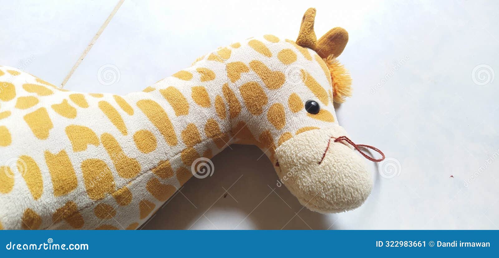 The Giraffe Doll is Placed on the Floor with a Rope in Its Mount Stock ...