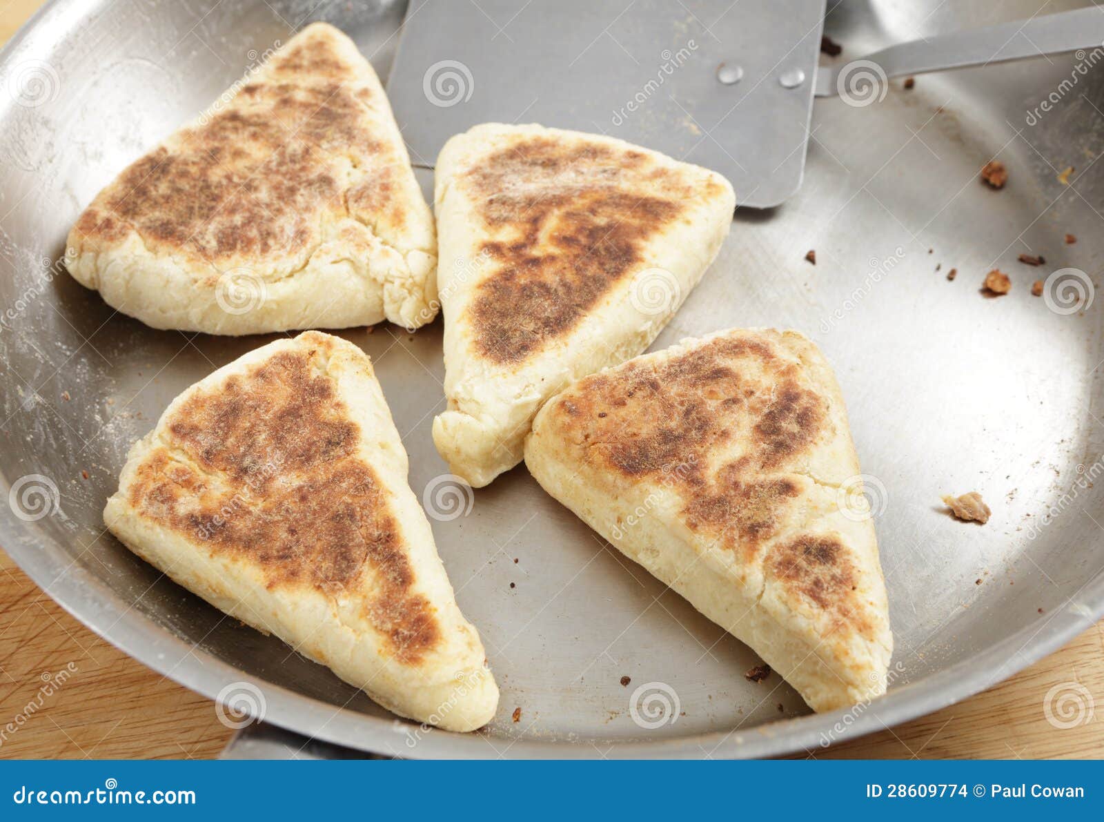 Girdle Scones Cooking in a Pan Stock Photo - Image of scone, texture ...